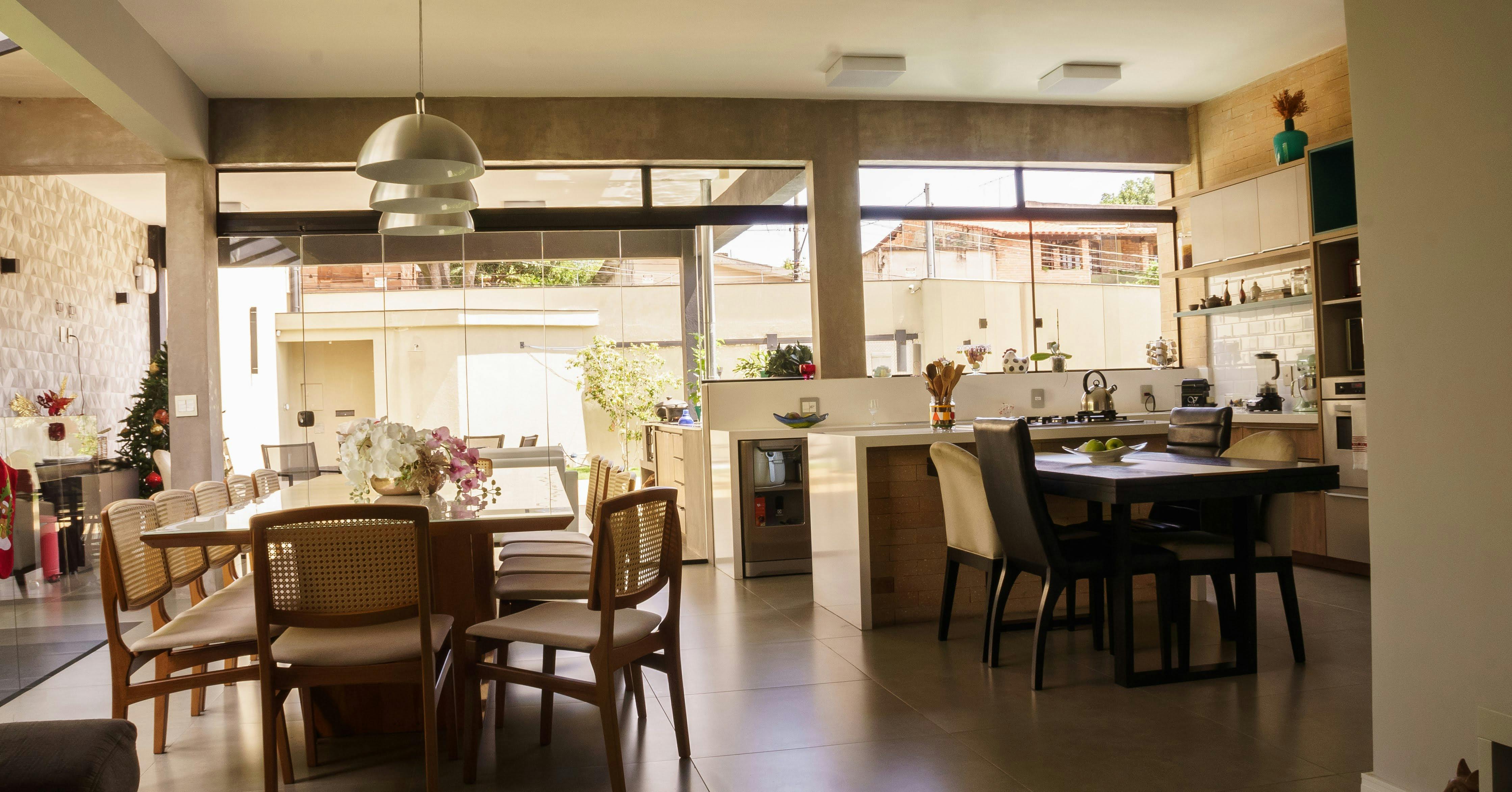 A Dining Table and Chairs Near the Kitchen Cabinets · Free Stock Photo