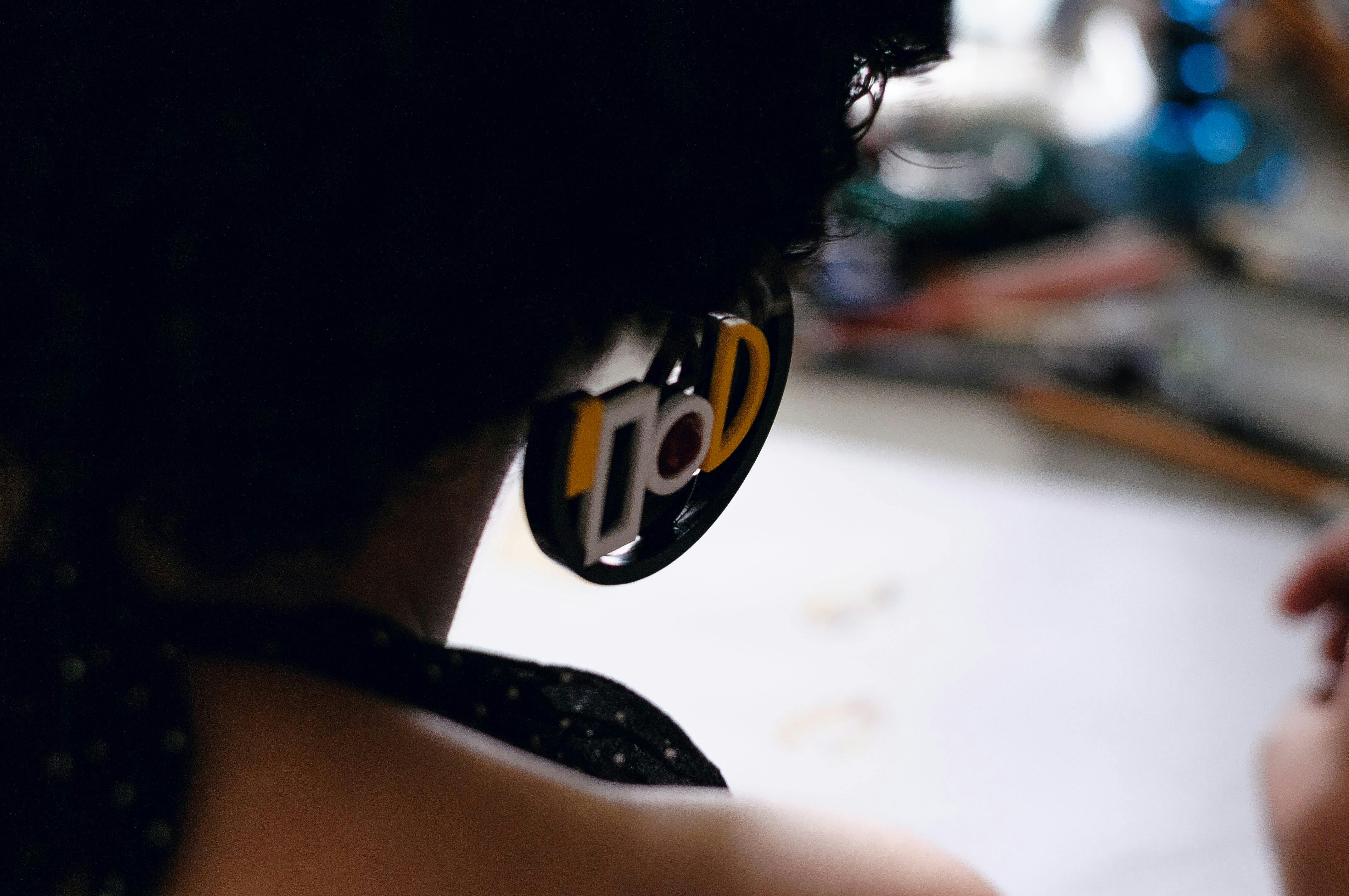 Male constructor drawing draft on paper roll · Free Stock Photo