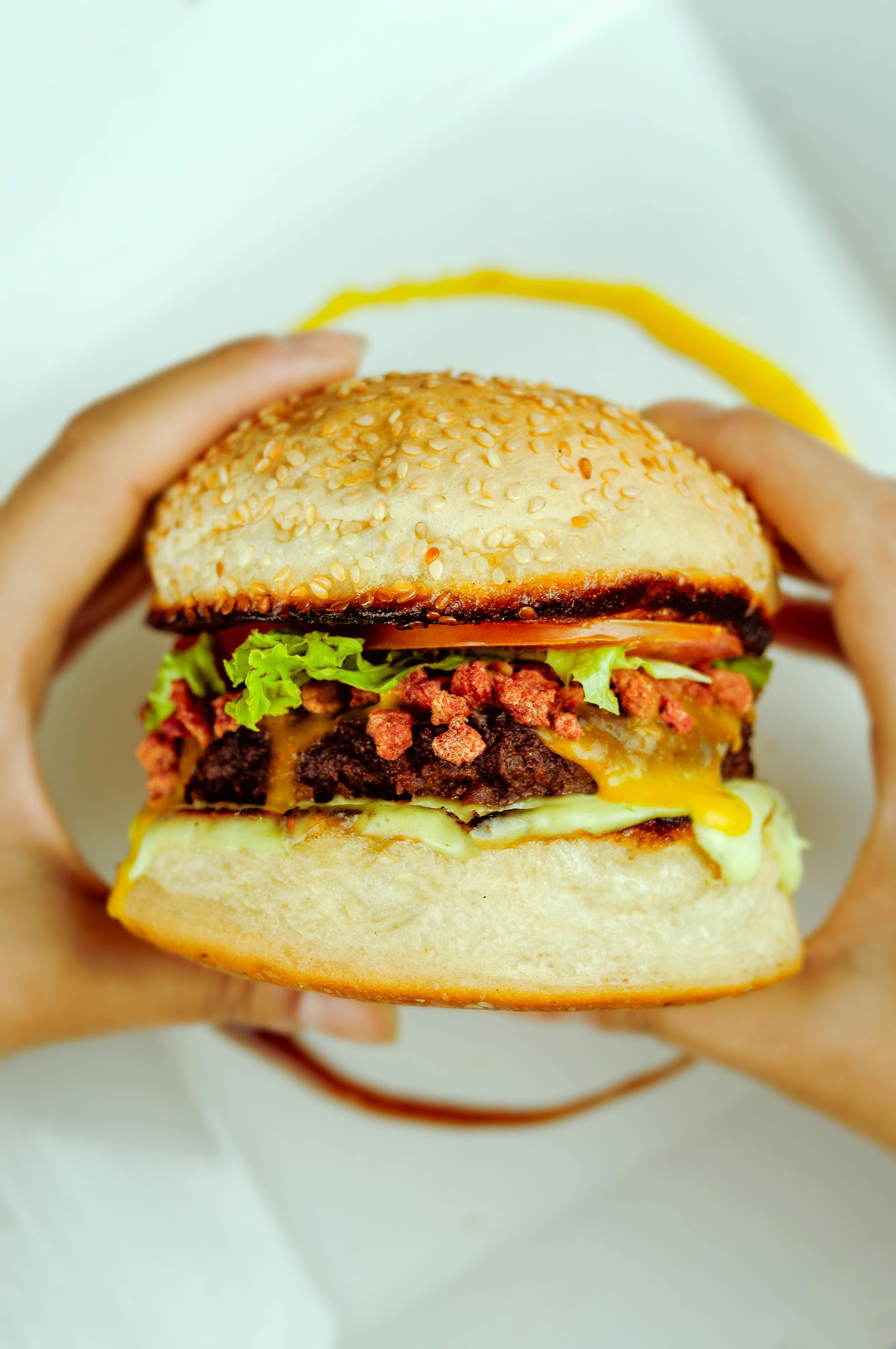 Crop male chef serving delicious sandwich · Free Stock Photo