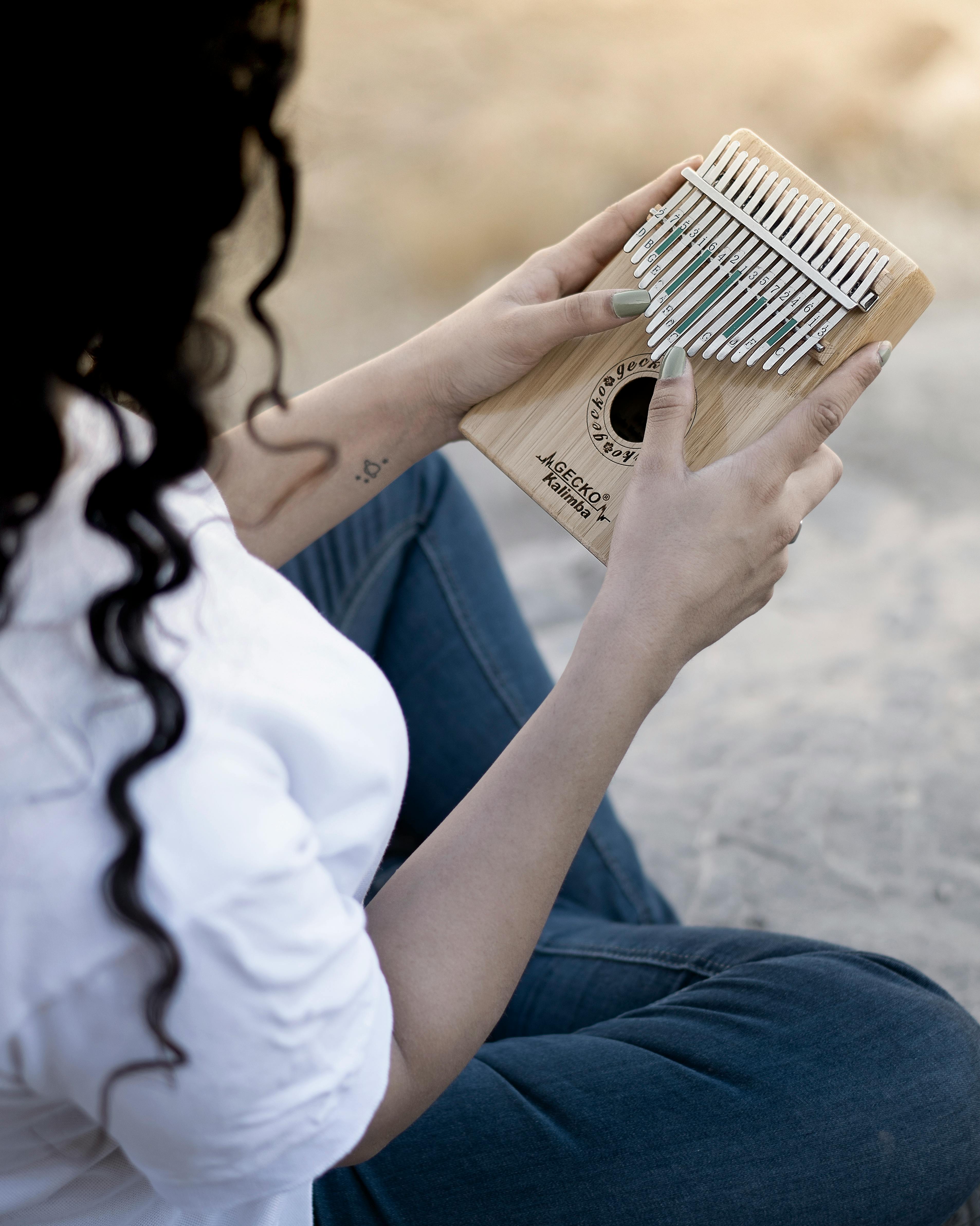 Close-Up Shot of a Person Playing Kalimba · Free Stock Photo