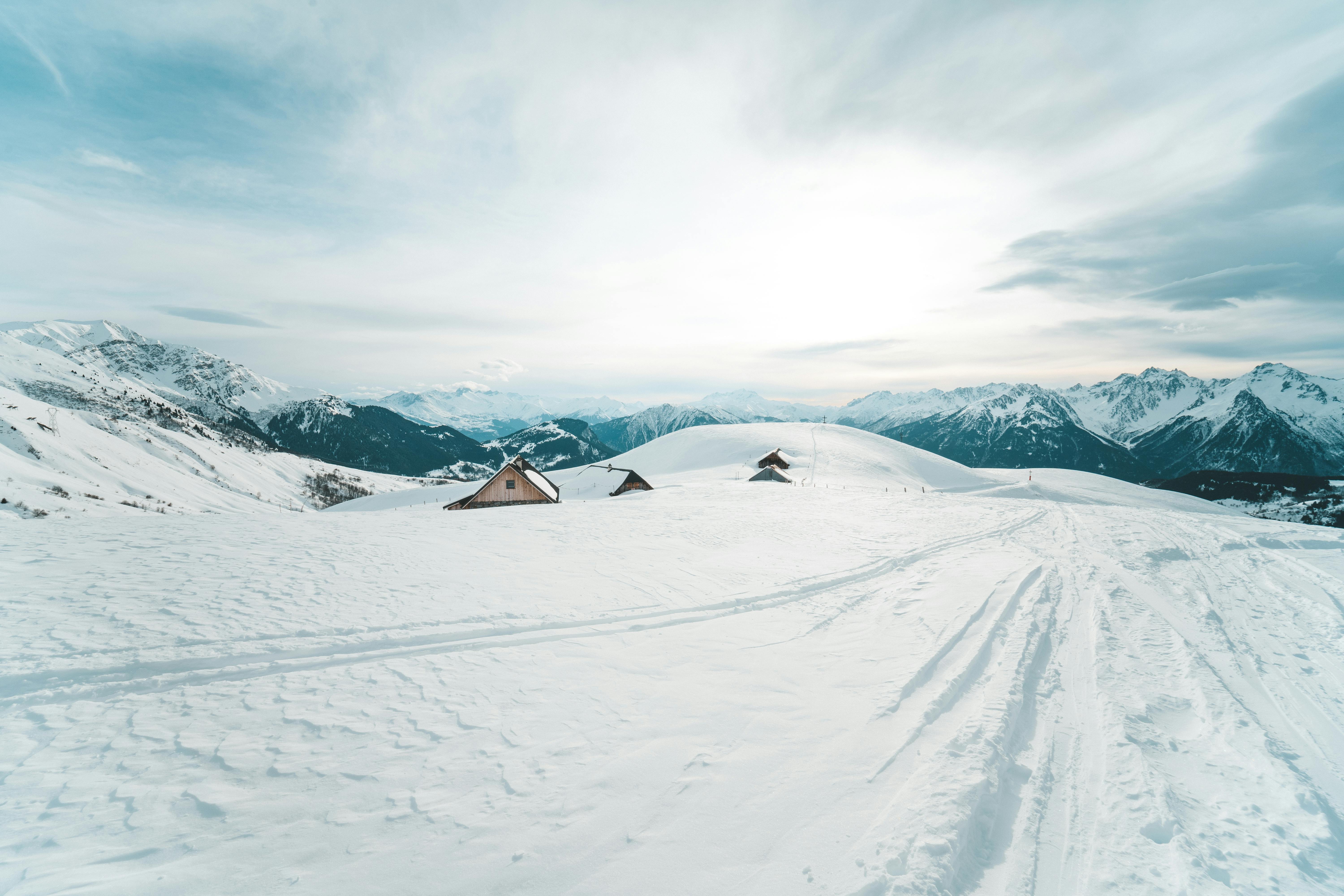 Trails on a Snow Field during the Day · Free Stock Photo