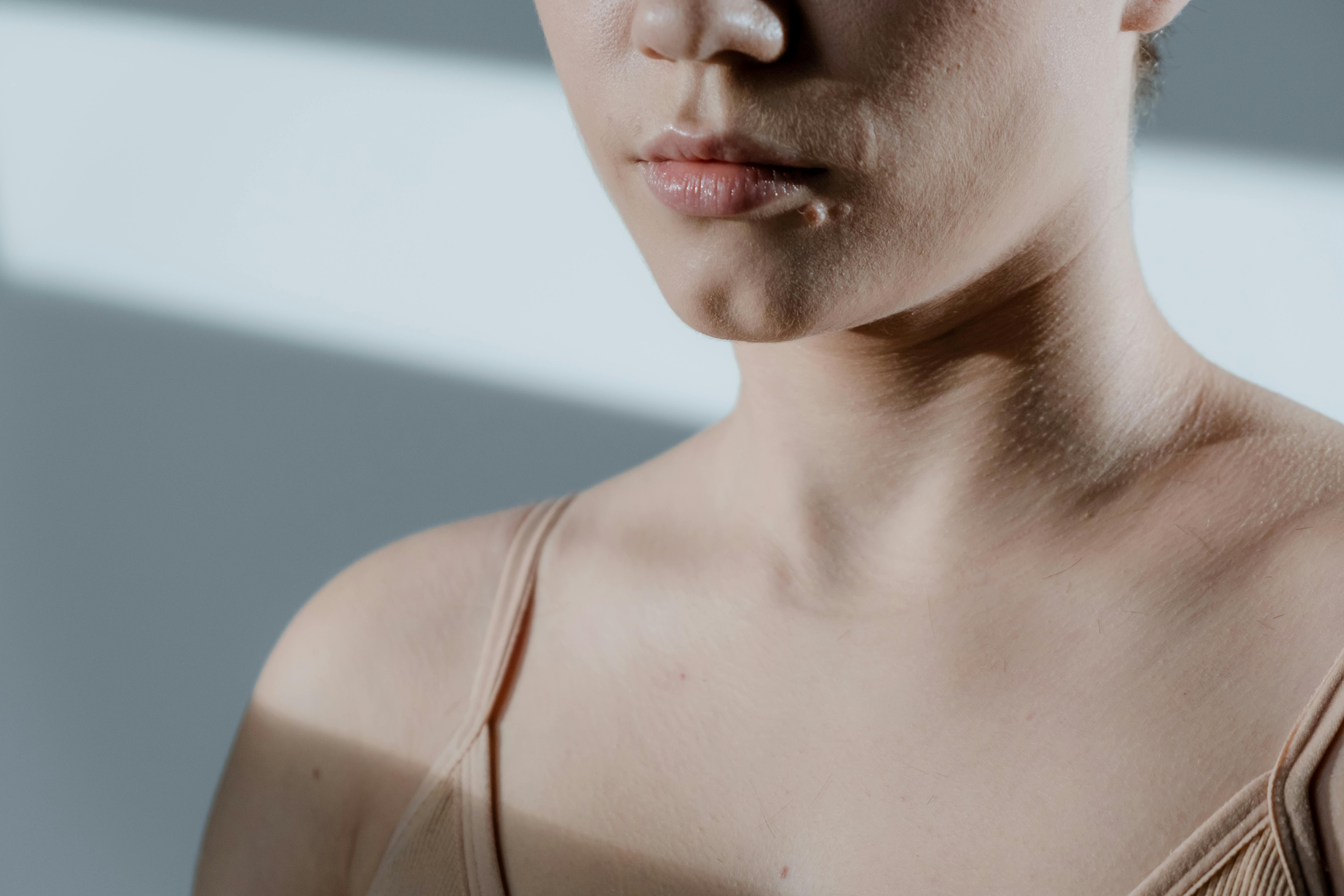 Close-up Shot of a Woman's Neck · Free Stock Photo