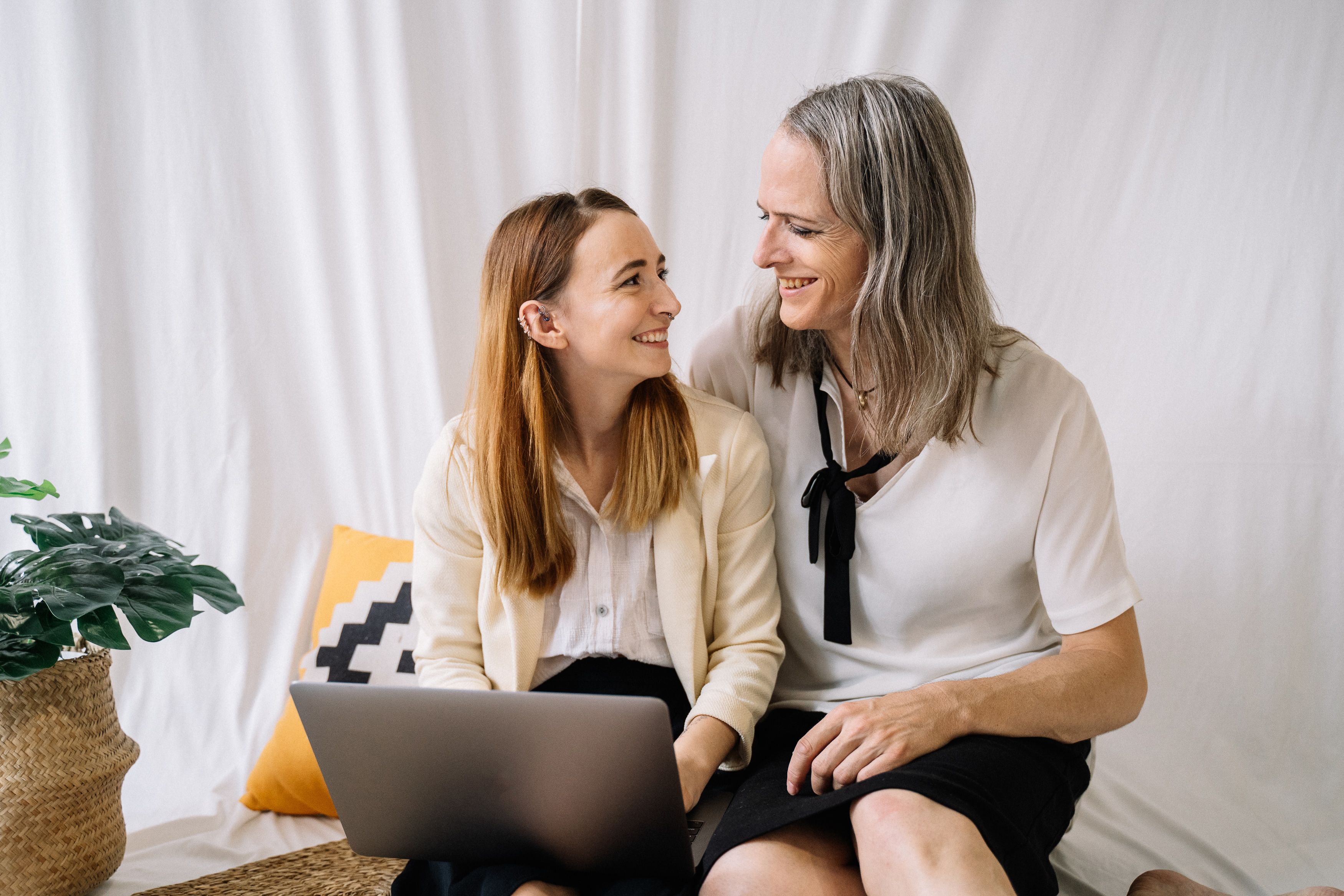 Women Sitting Down Smiling · Free Stock Photo