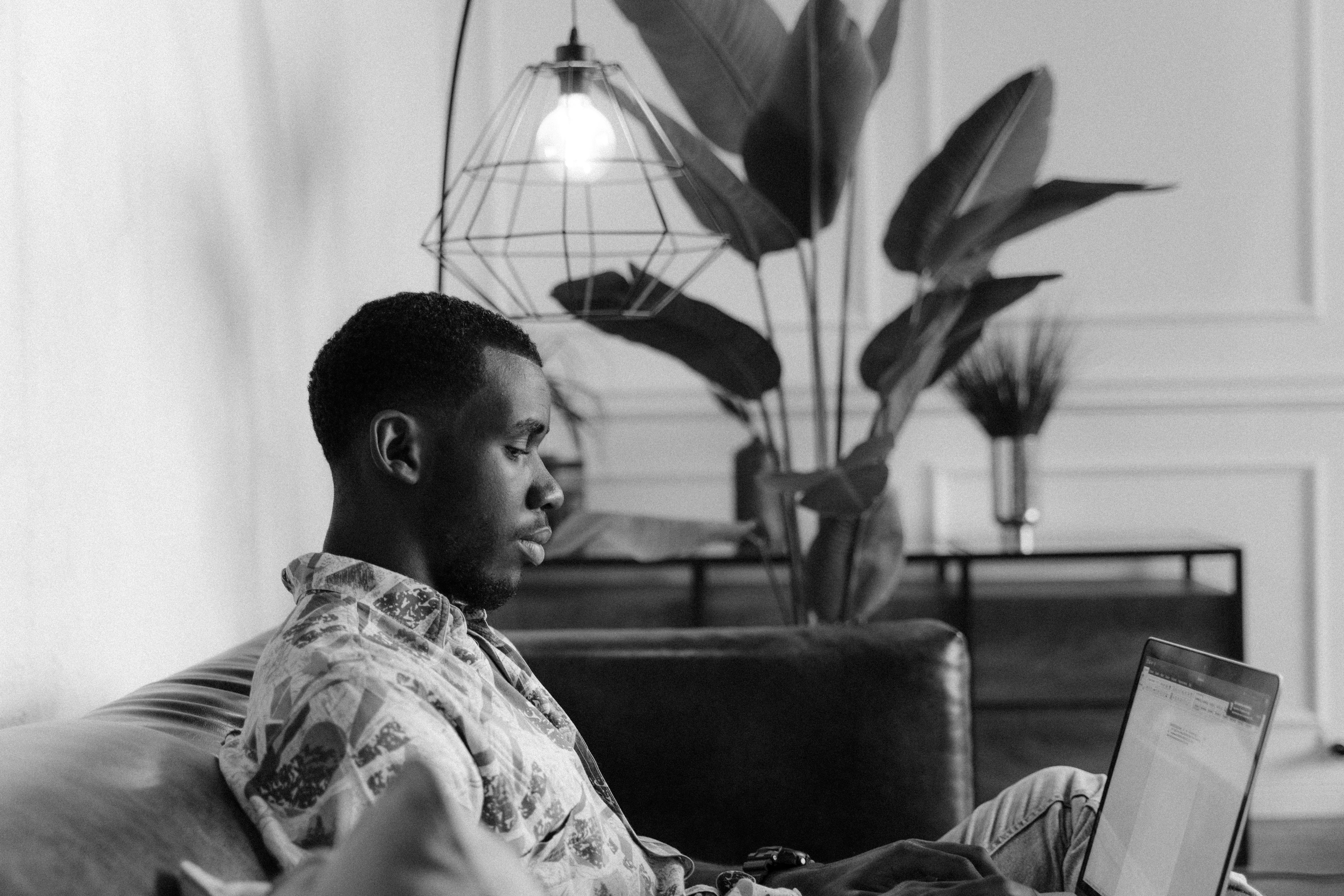 Side View of a Man using Laptop · Free Stock Photo