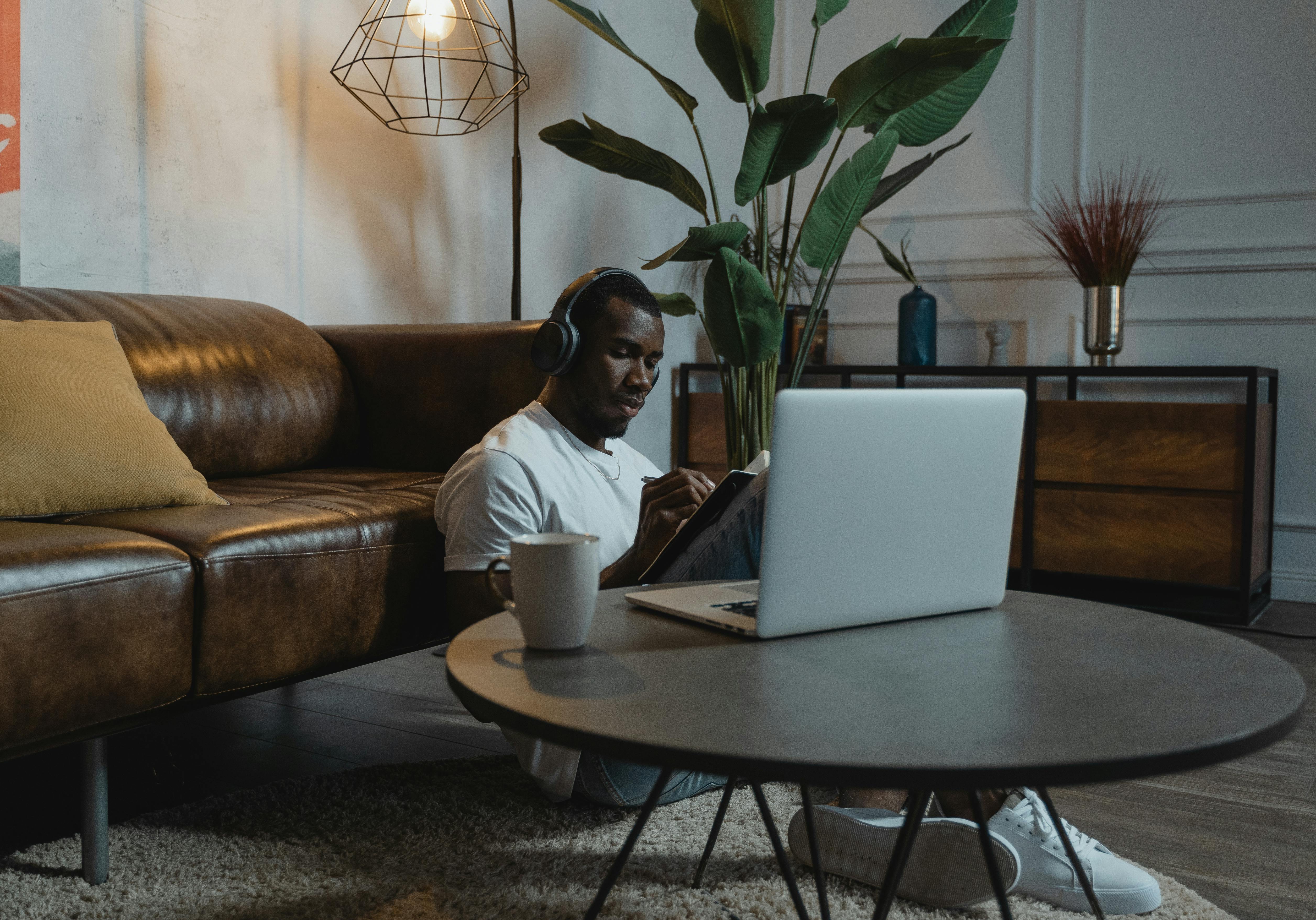 Man Having His Online Class in Living Room · Free Stock Photo