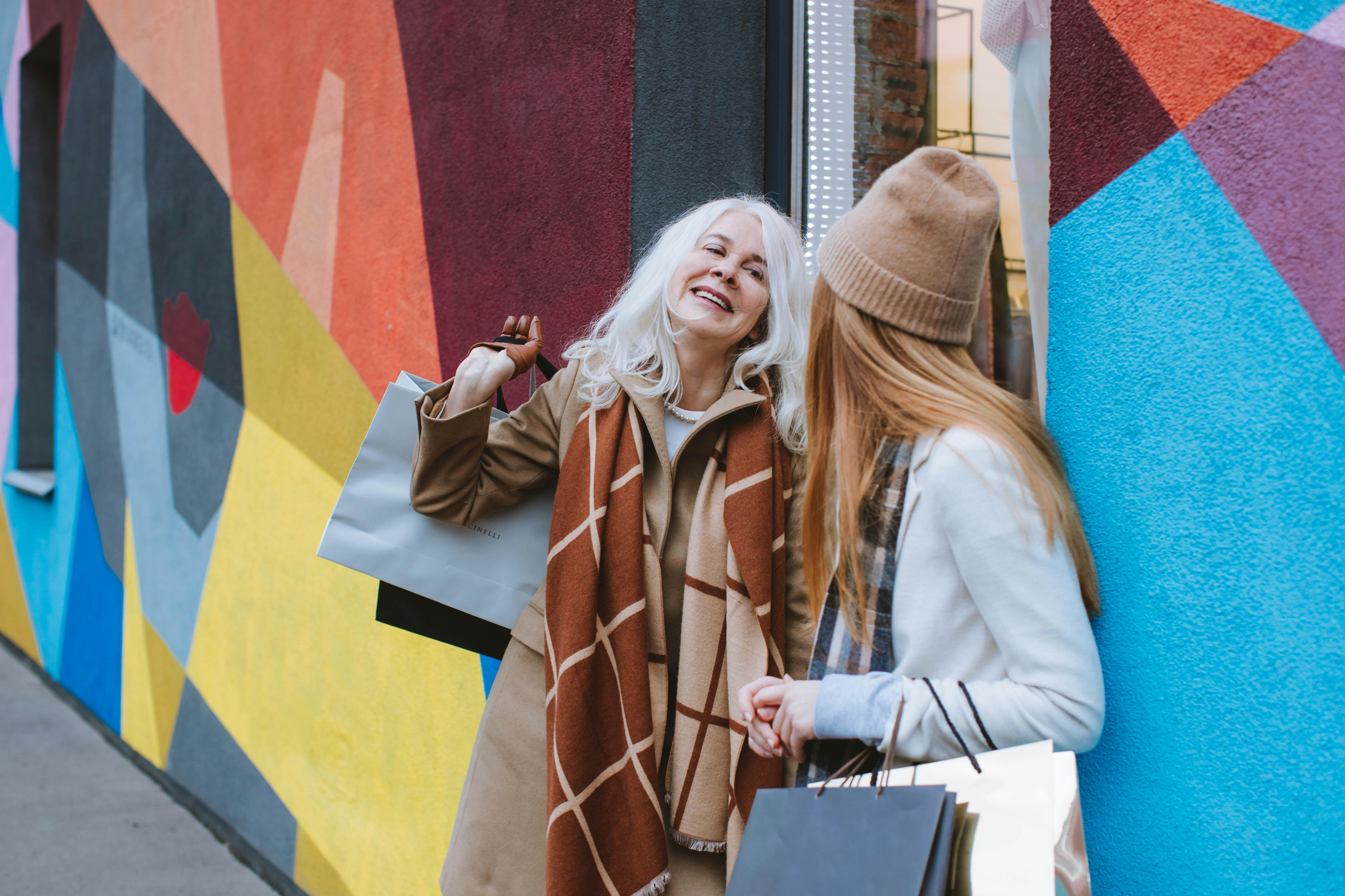 Two Women Holding Carrying Shopping Bags · Free Stock Photo