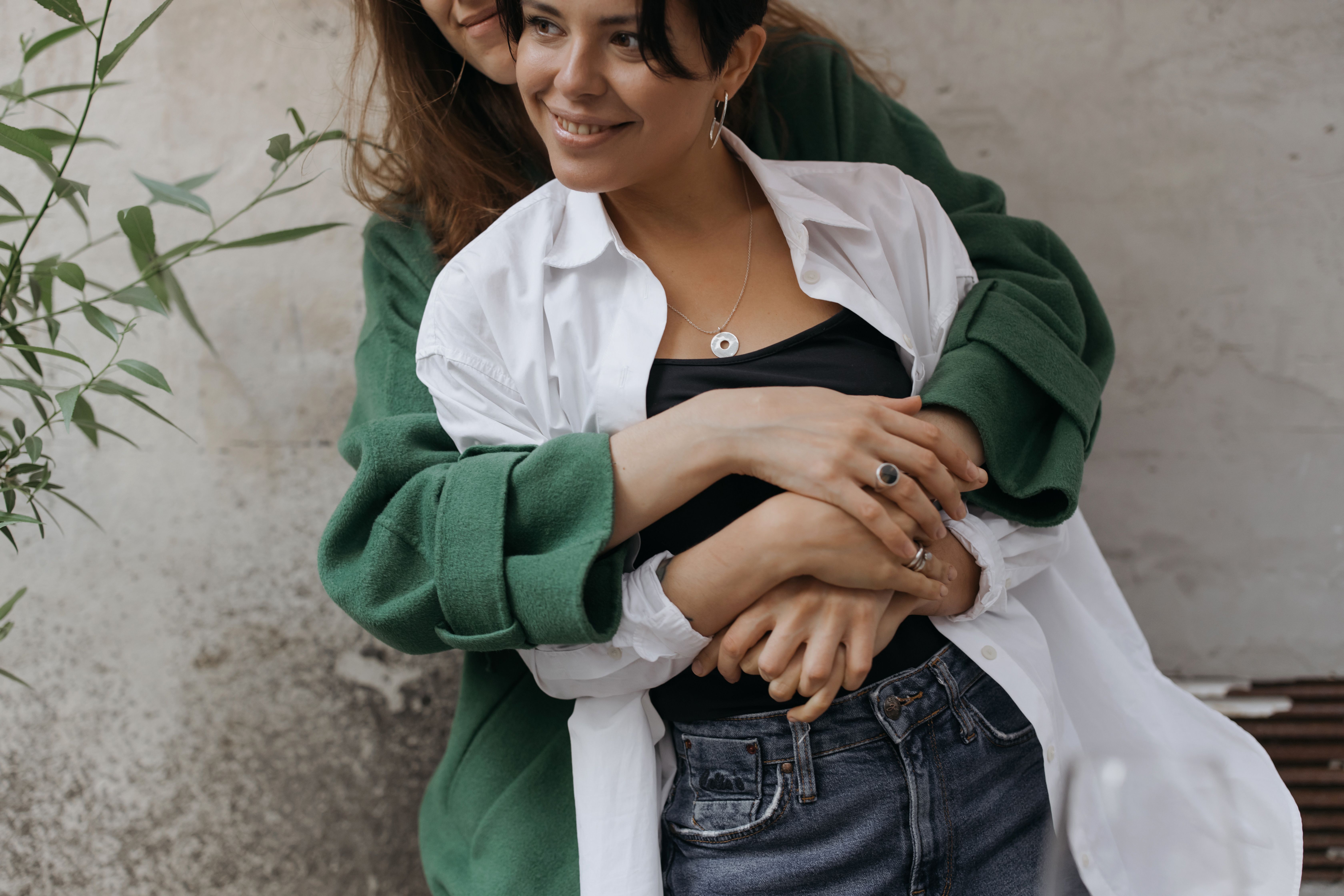 Woman Hugging a Woman From Behind · Free Stock Photo