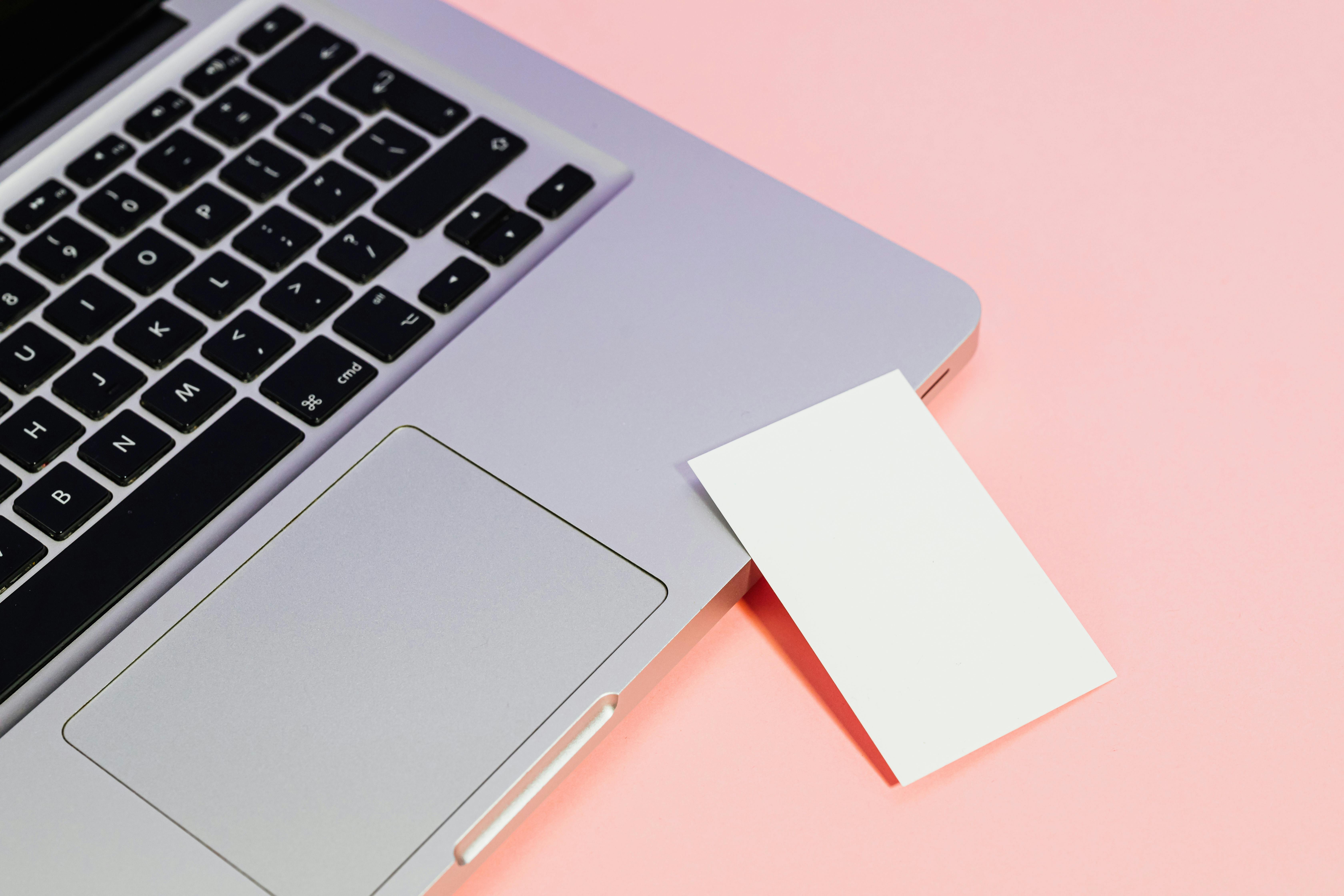 Small Paper Sheet on a Laptop · Free Stock Photo