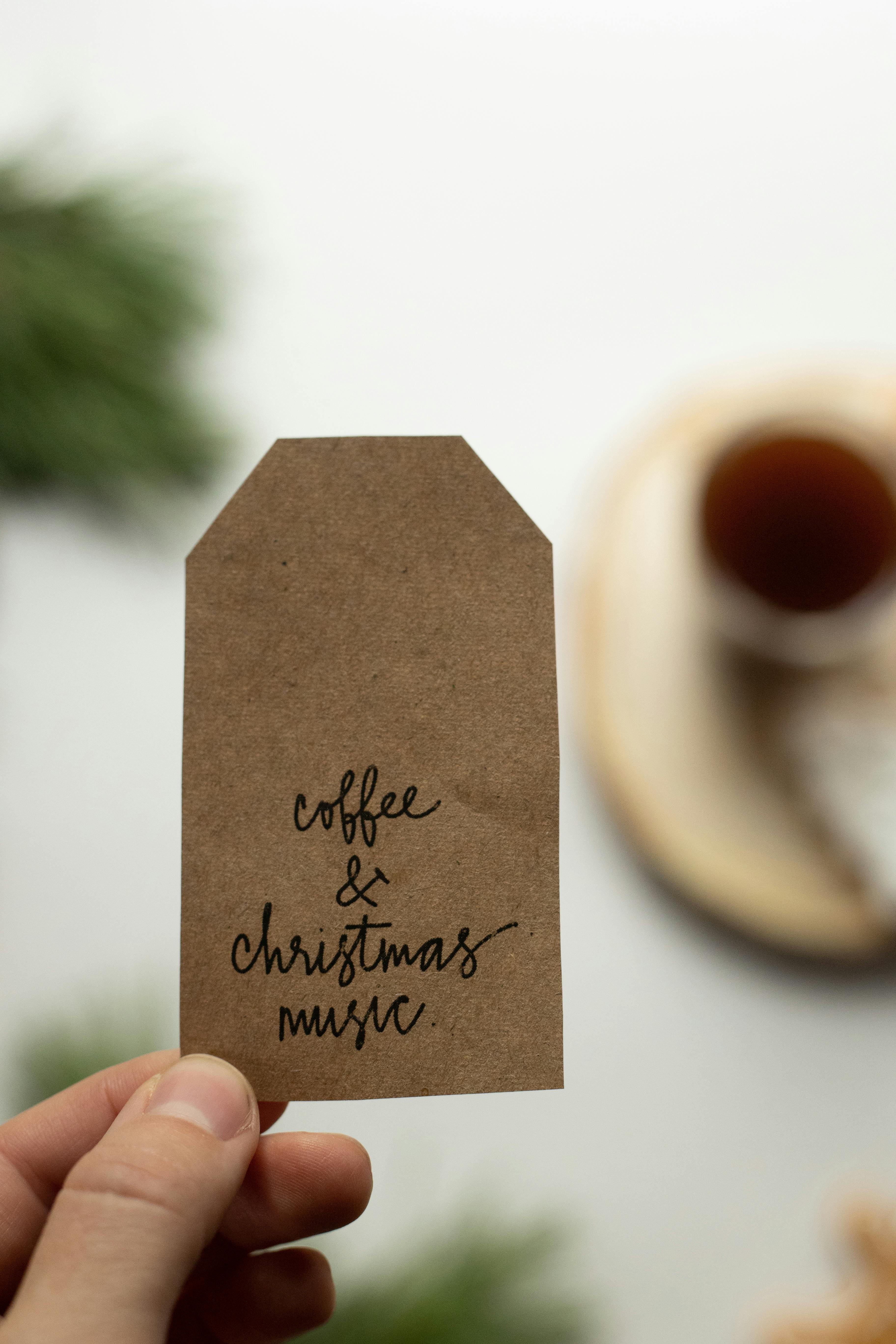 Collection of Christmas tags arranged on plank table · Free Stock Photo