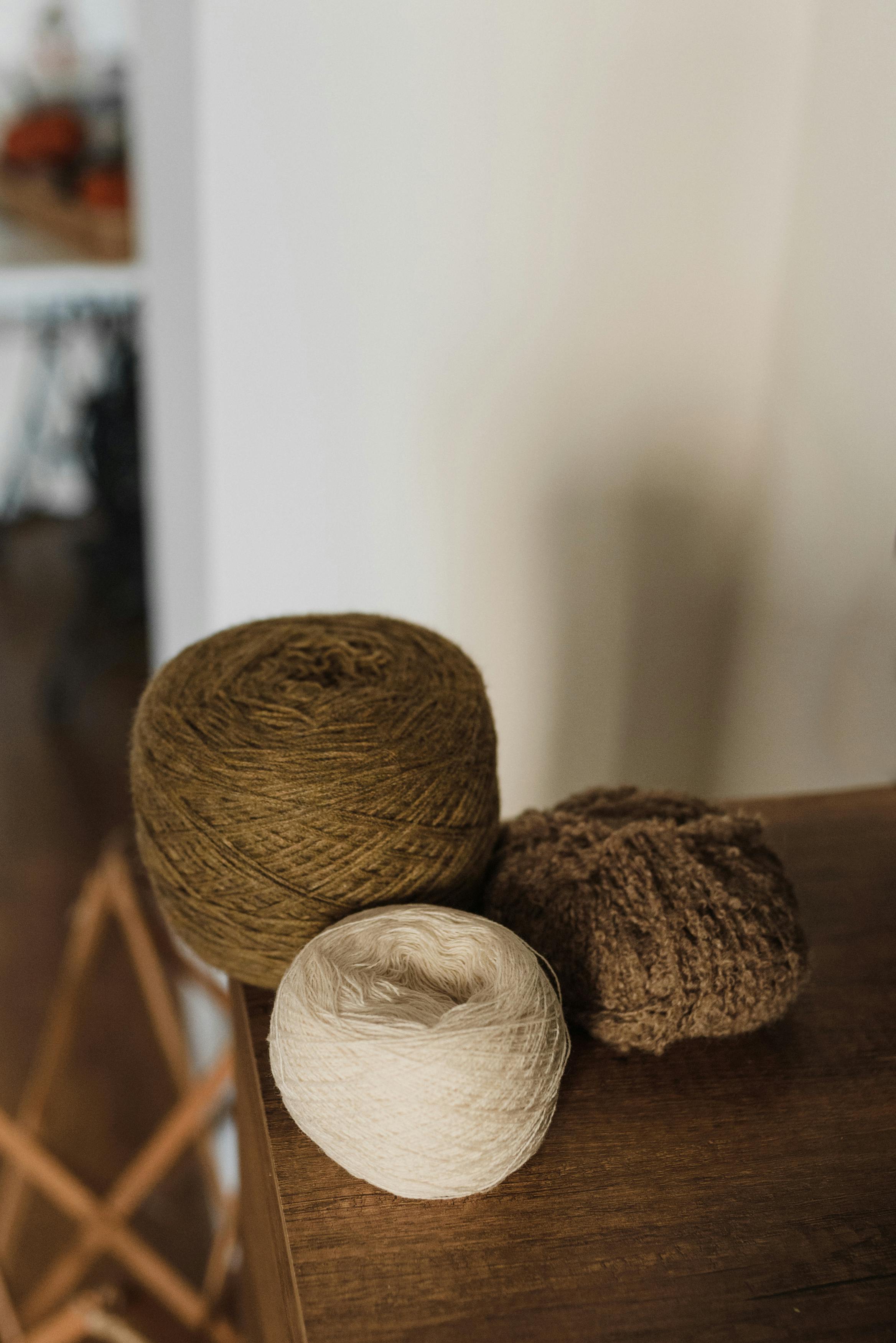 Yarn Roll and Threads on Top of a Cabinet · Free Stock Photo