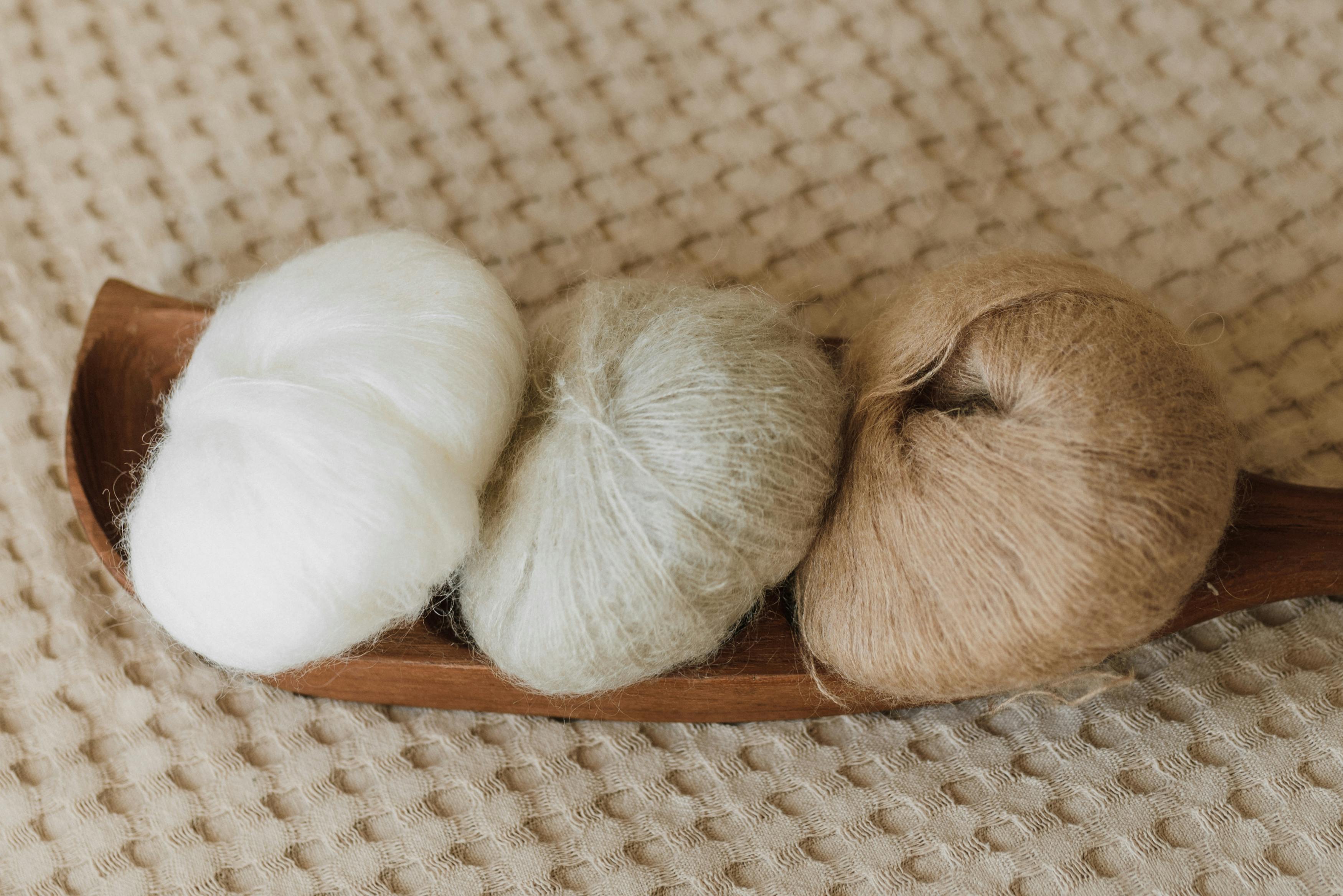 Yarn Rolls on a Wooden Tay · Free Stock Photo