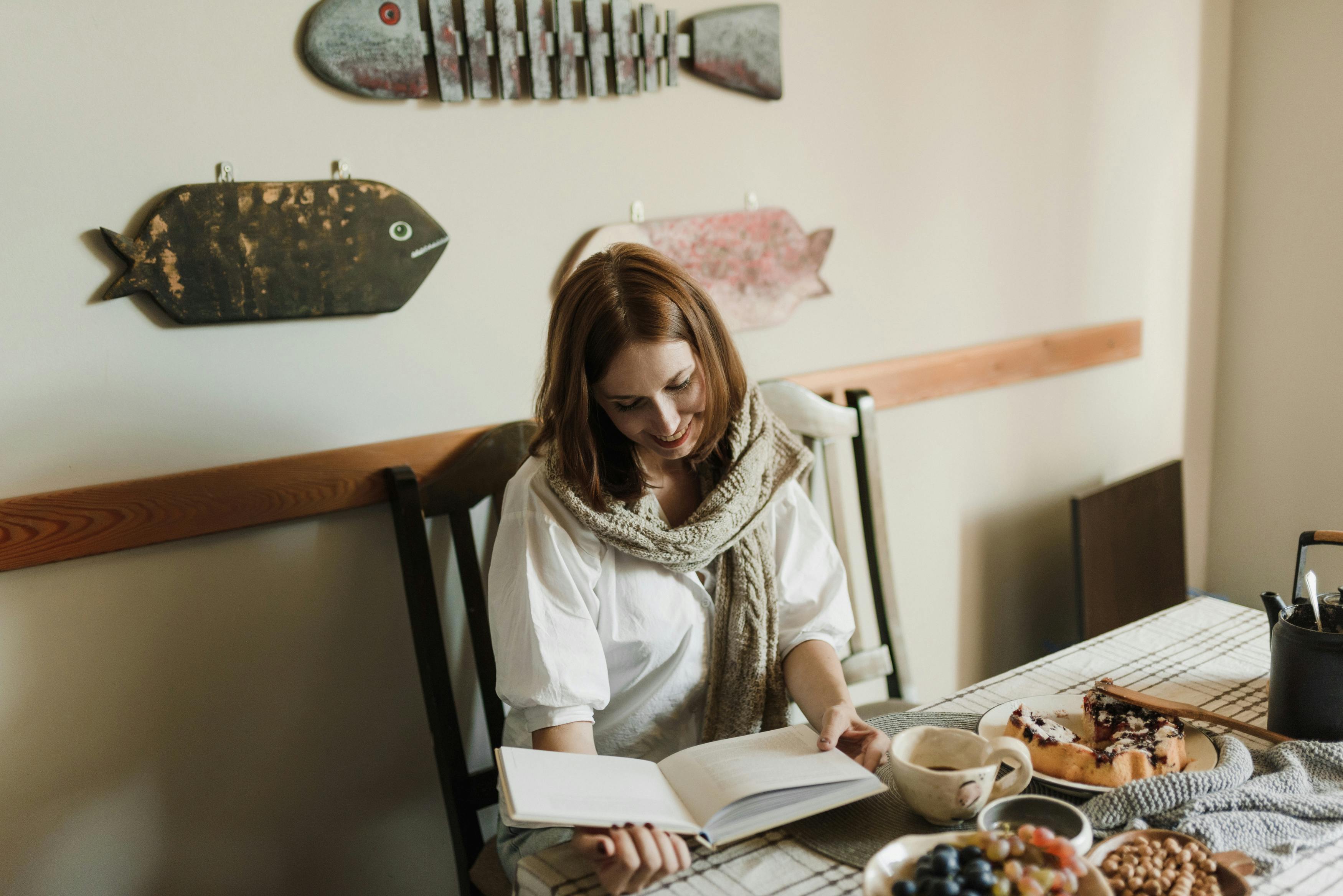 A Woman Sitting at the Table · Free Stock Photo
