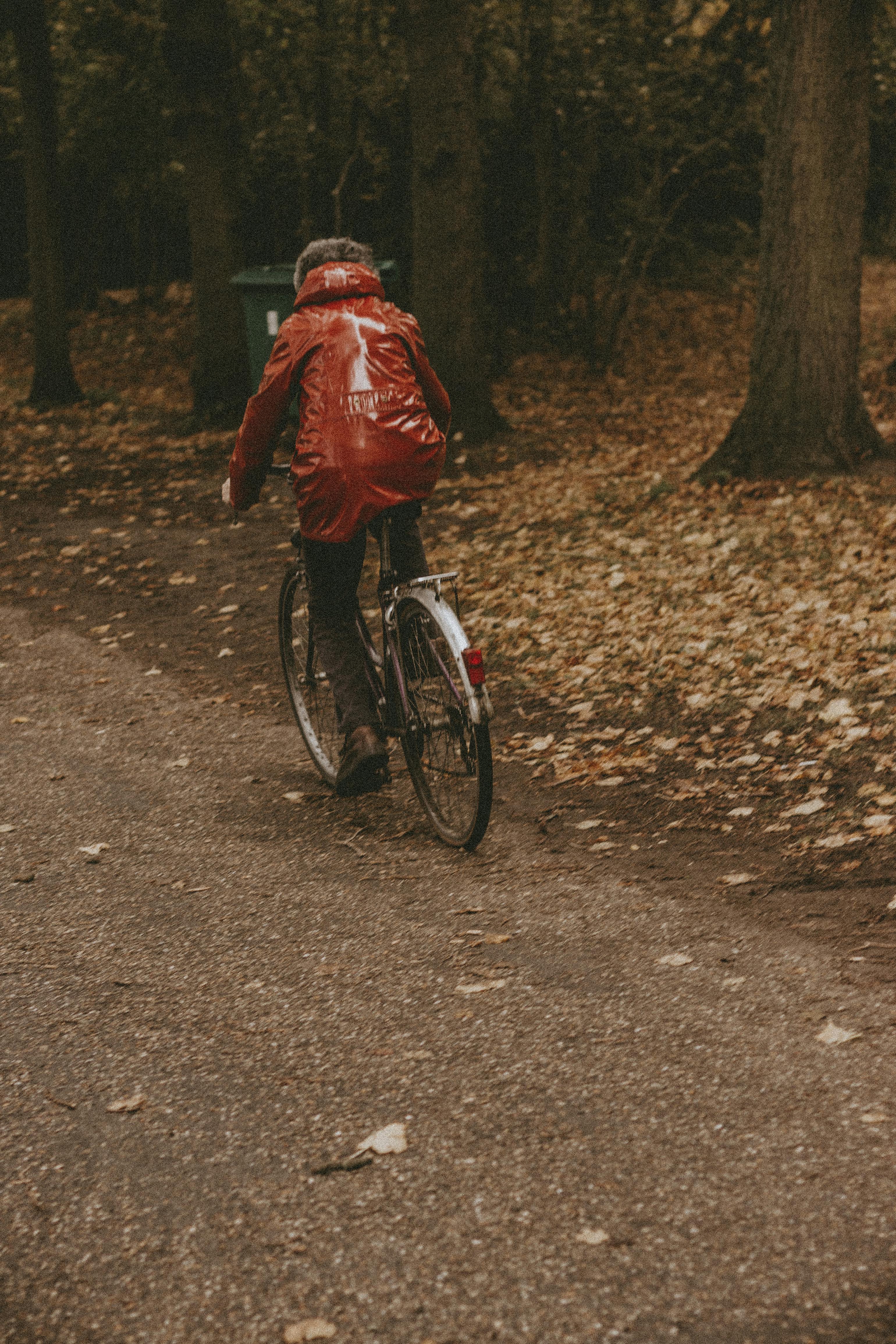 Anonymous kid in helmet riding run bike on pavement in countryside ...