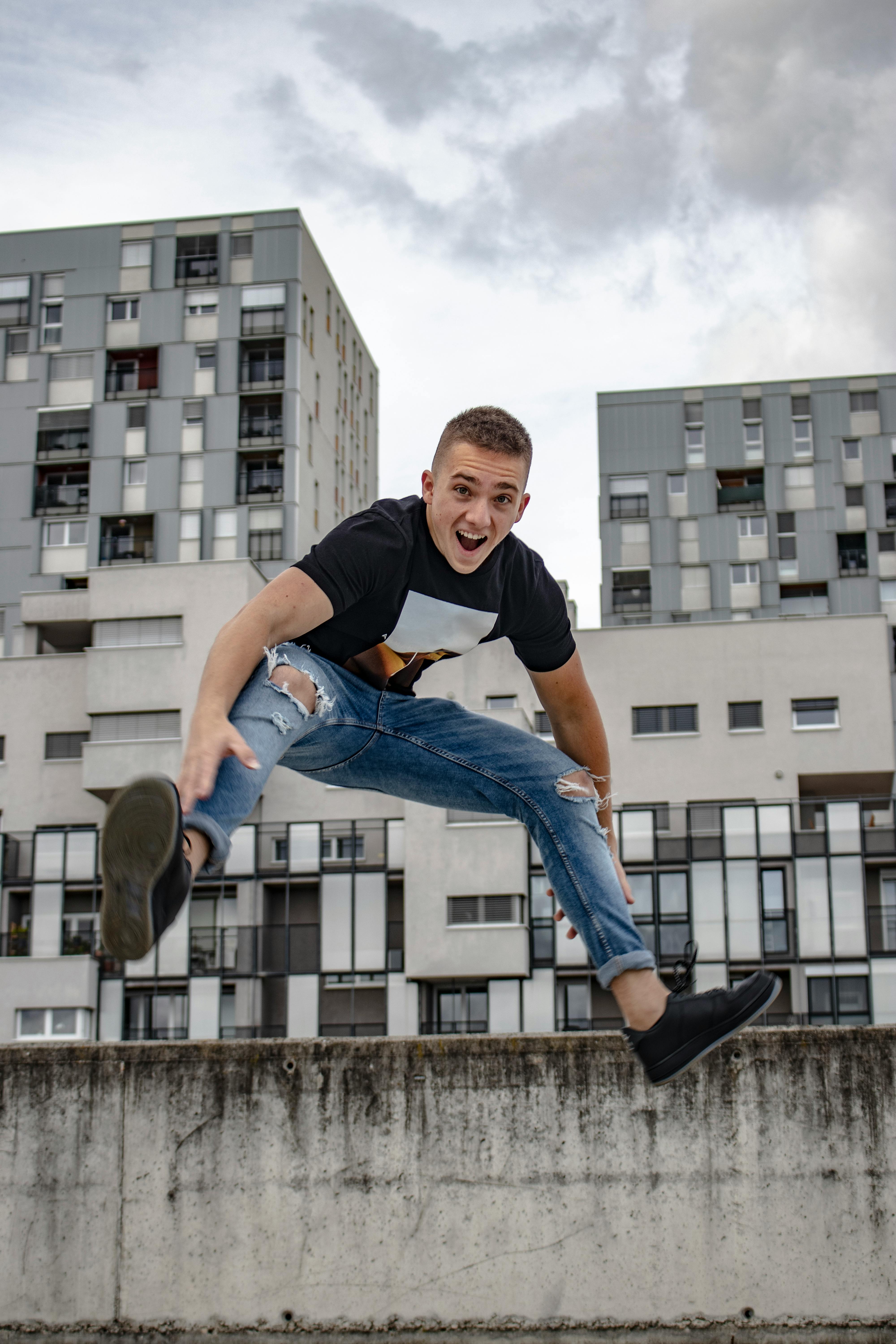 Man Jumping Over Building Photos, Download The BEST Free Man Jumping ...