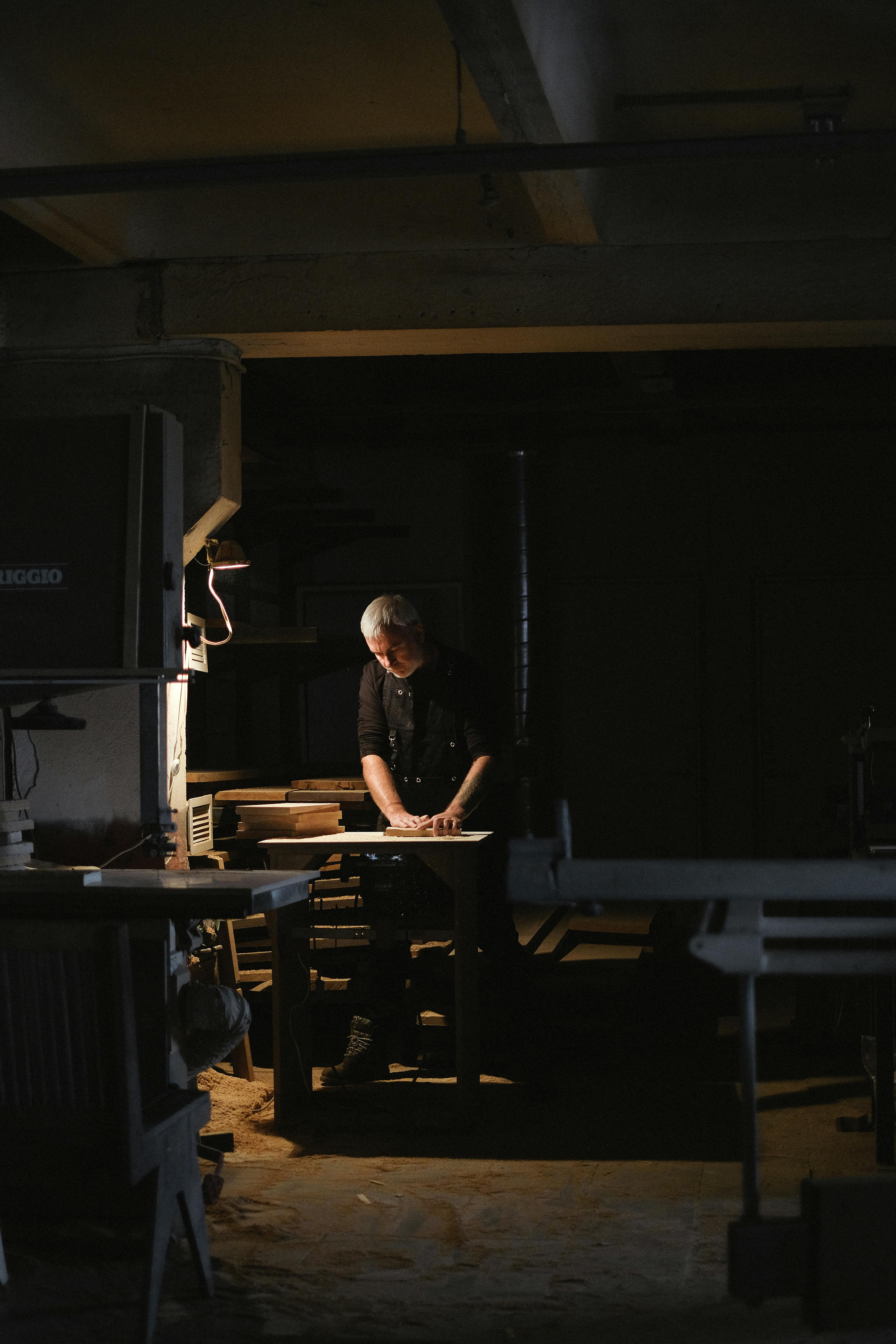 Professional Craftsman Working on Workbench · Free Stock Photo