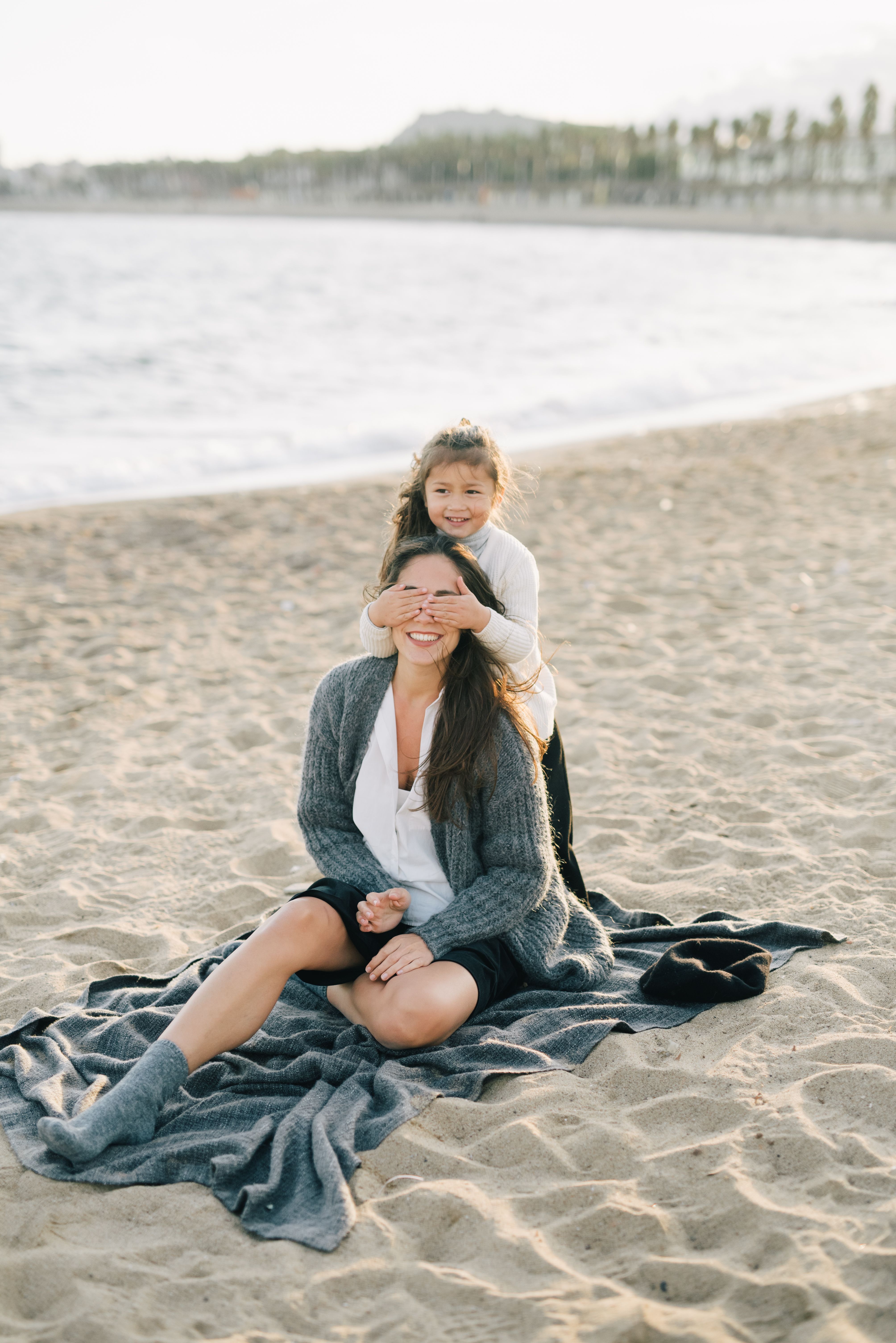 A Girl Covering her Mother Eyes · Free Stock Photo