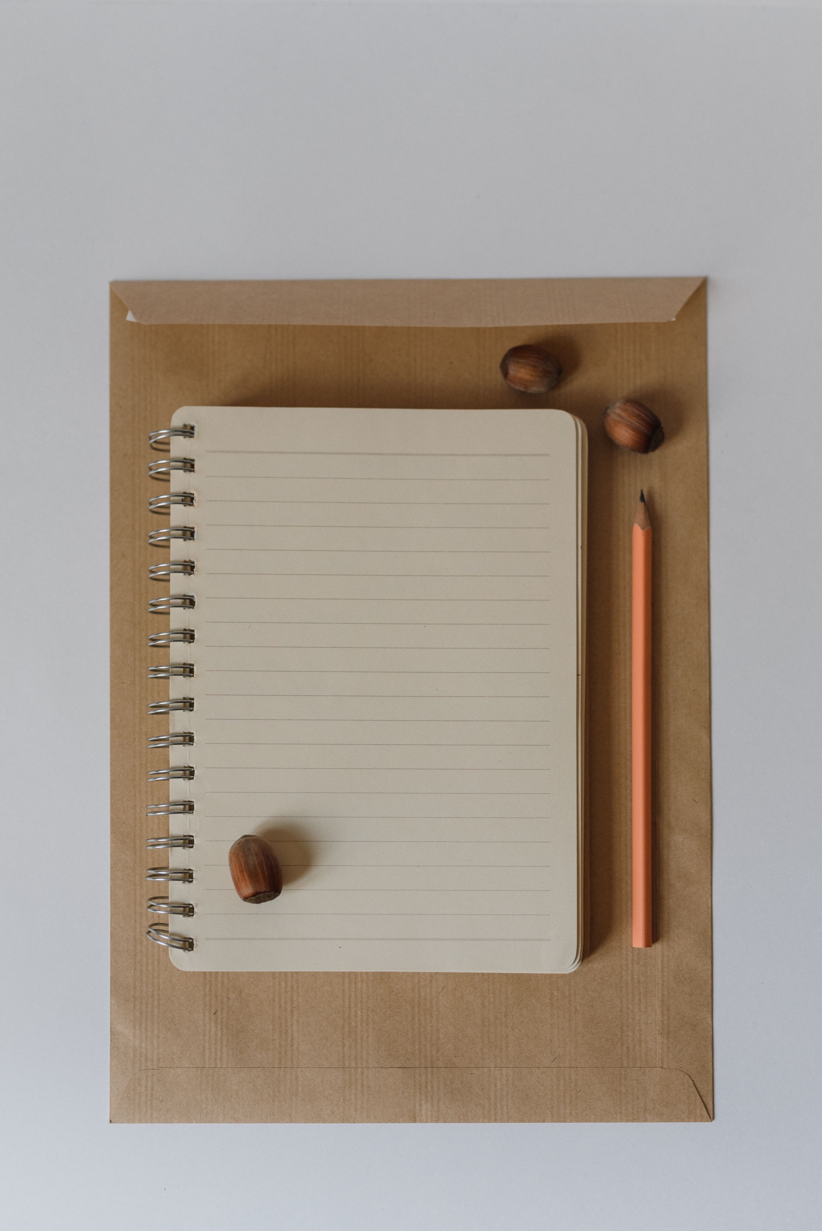 Flat Lay of a Notebook and Pencil · Free Stock Photo
