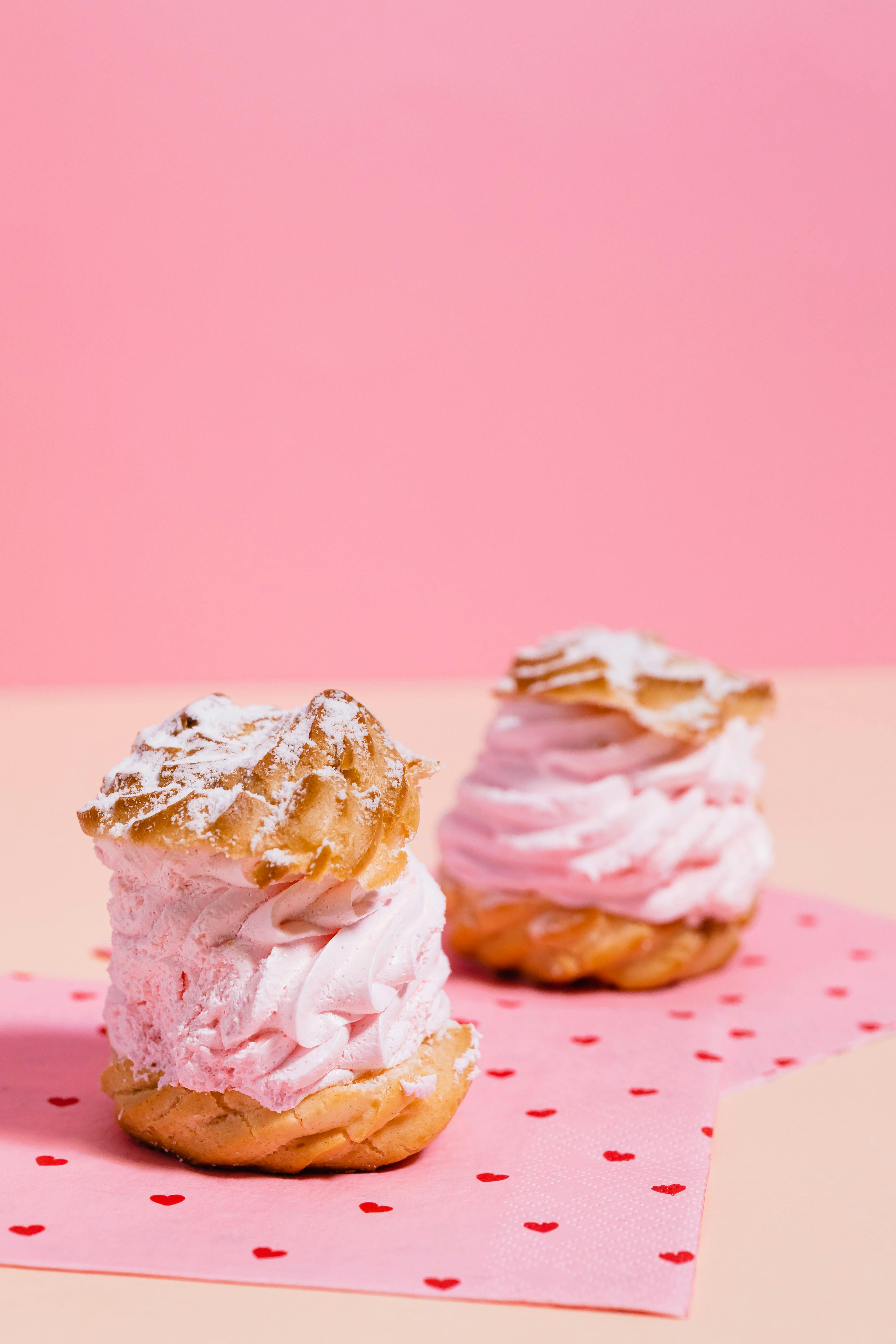 Delectable Cream Puffs Filled with Pink Icing · Free Stock Photo