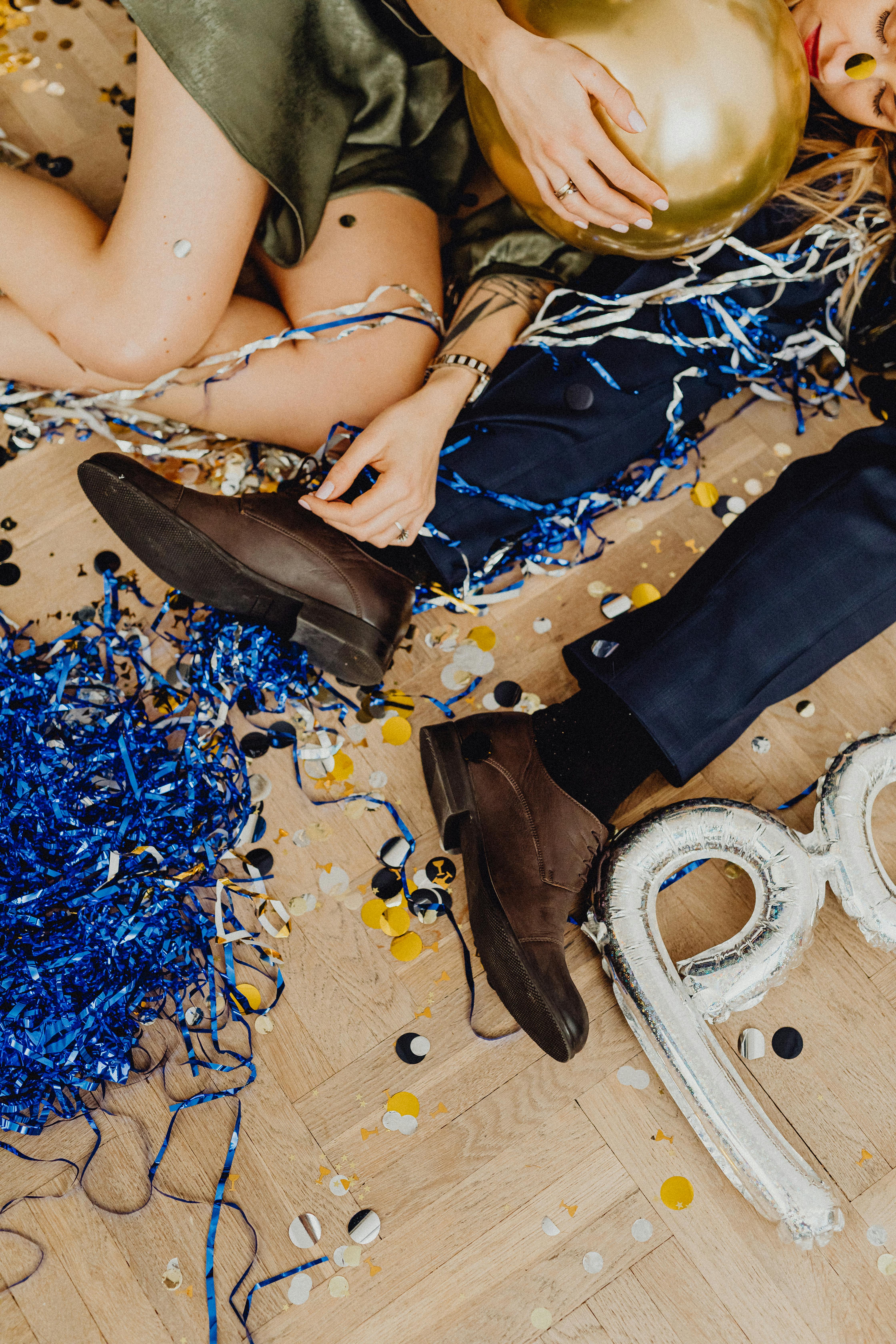 Two People on the Floor after a Party · Free Stock Photo