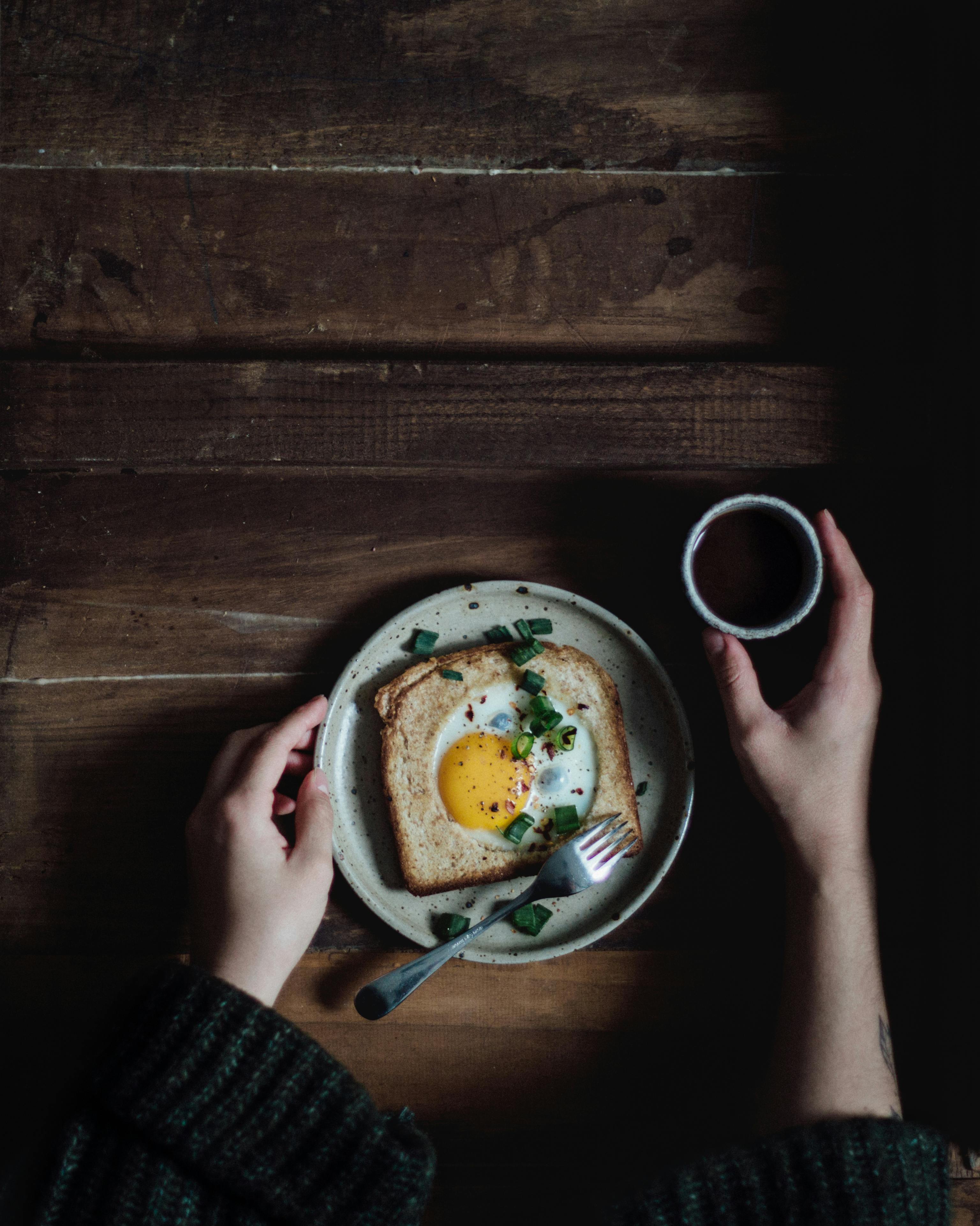 Woman Hands and Breakfast on Rustic Table · Free Stock Photo