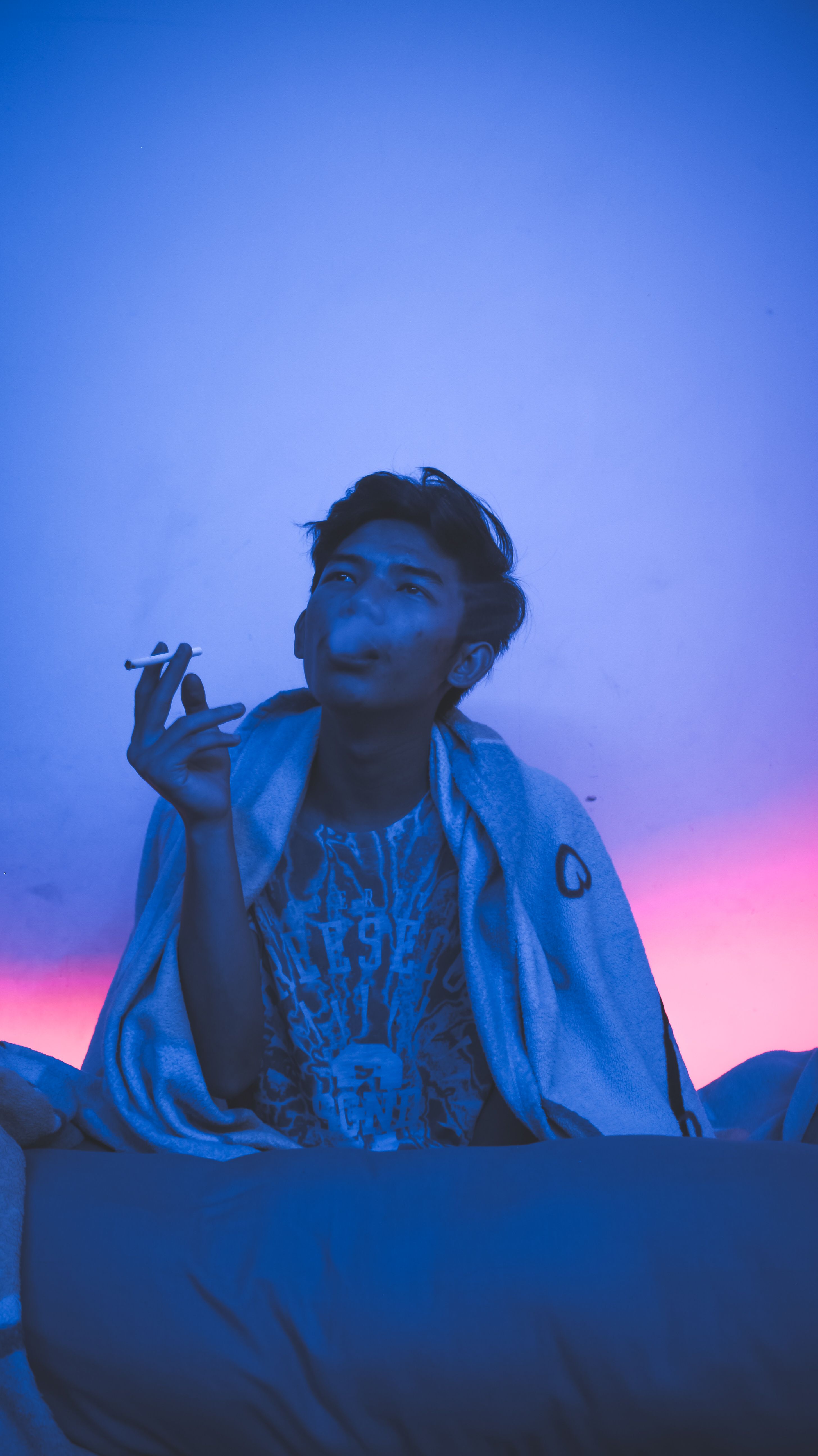 Man in Hat Lighting Cigarette · Free Stock Photo