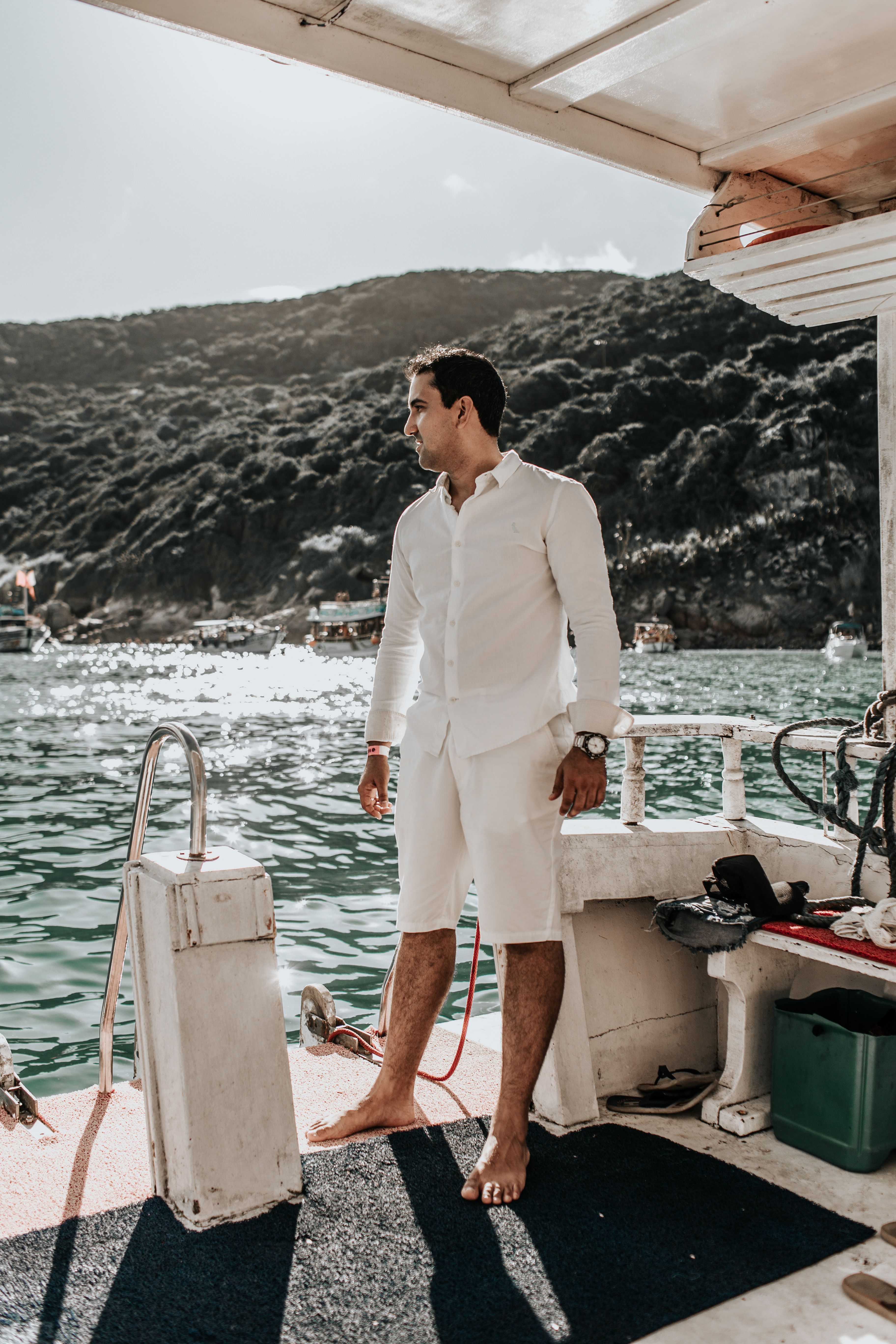 Confident man standing on boat sailing on sea · Free Stock Photo