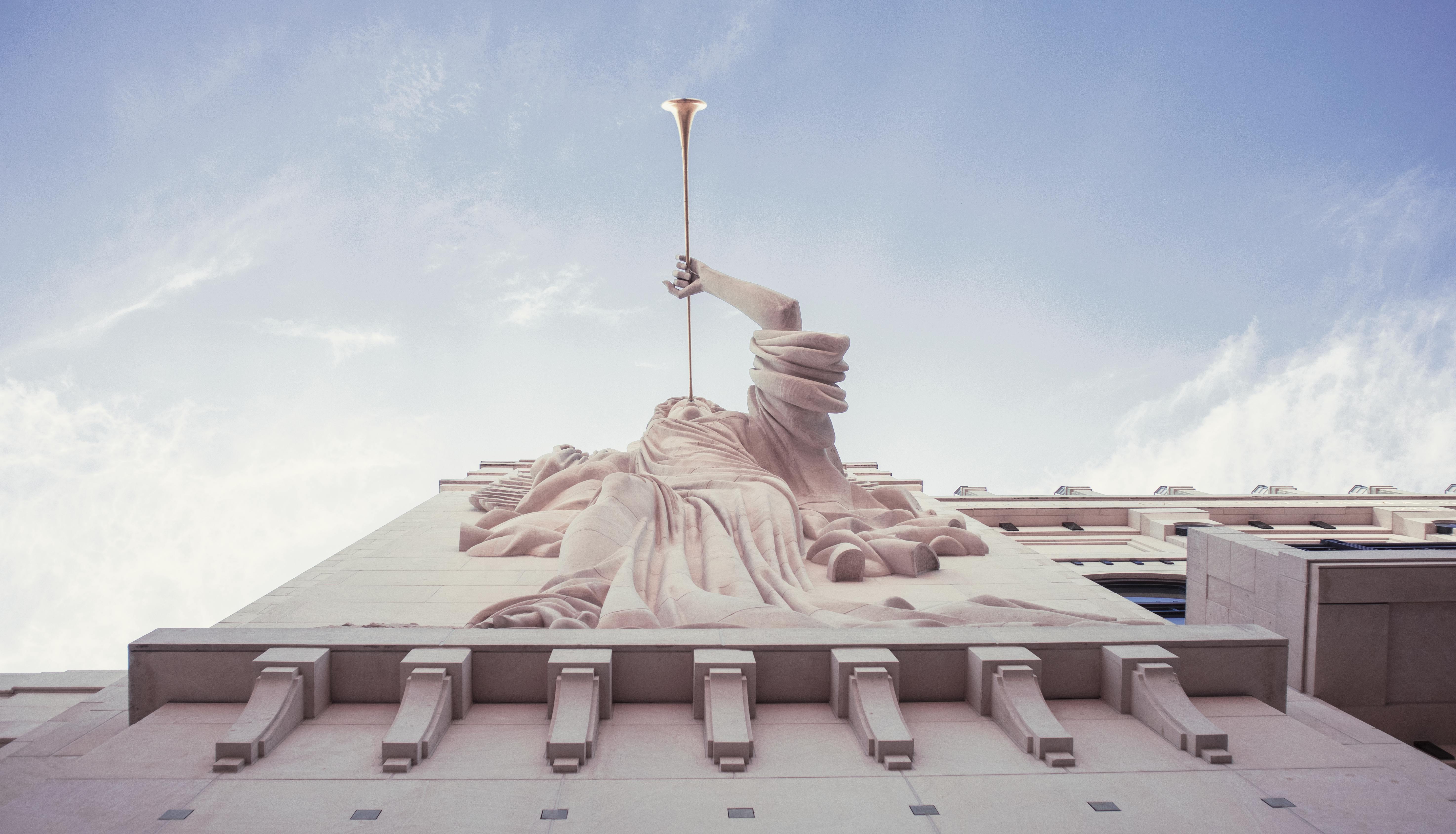 Angel Statue with Trumpet on Building · Free Stock Photo