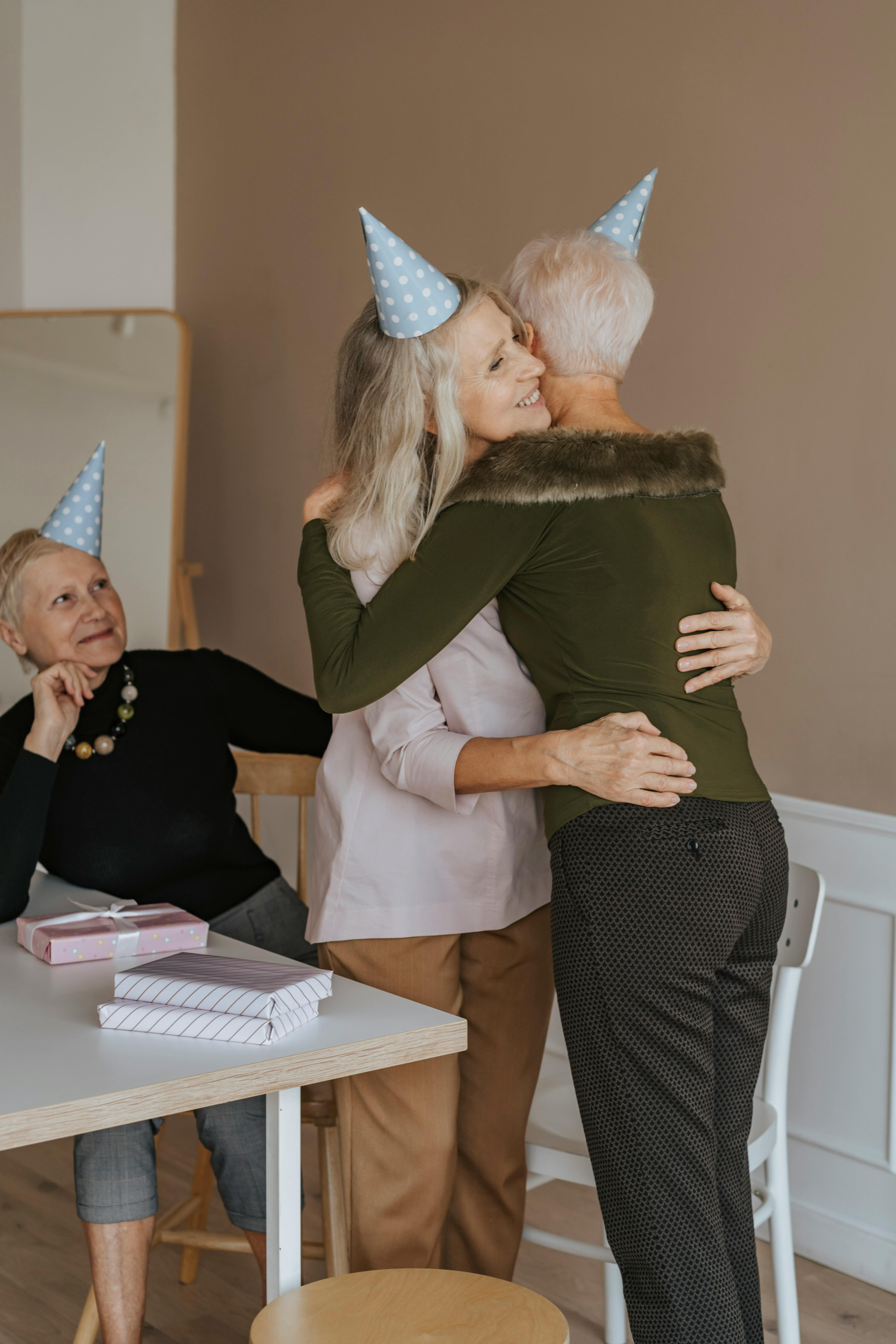 Photo of an Elderly Woman Hugging Her Friend · Free Stock Photo