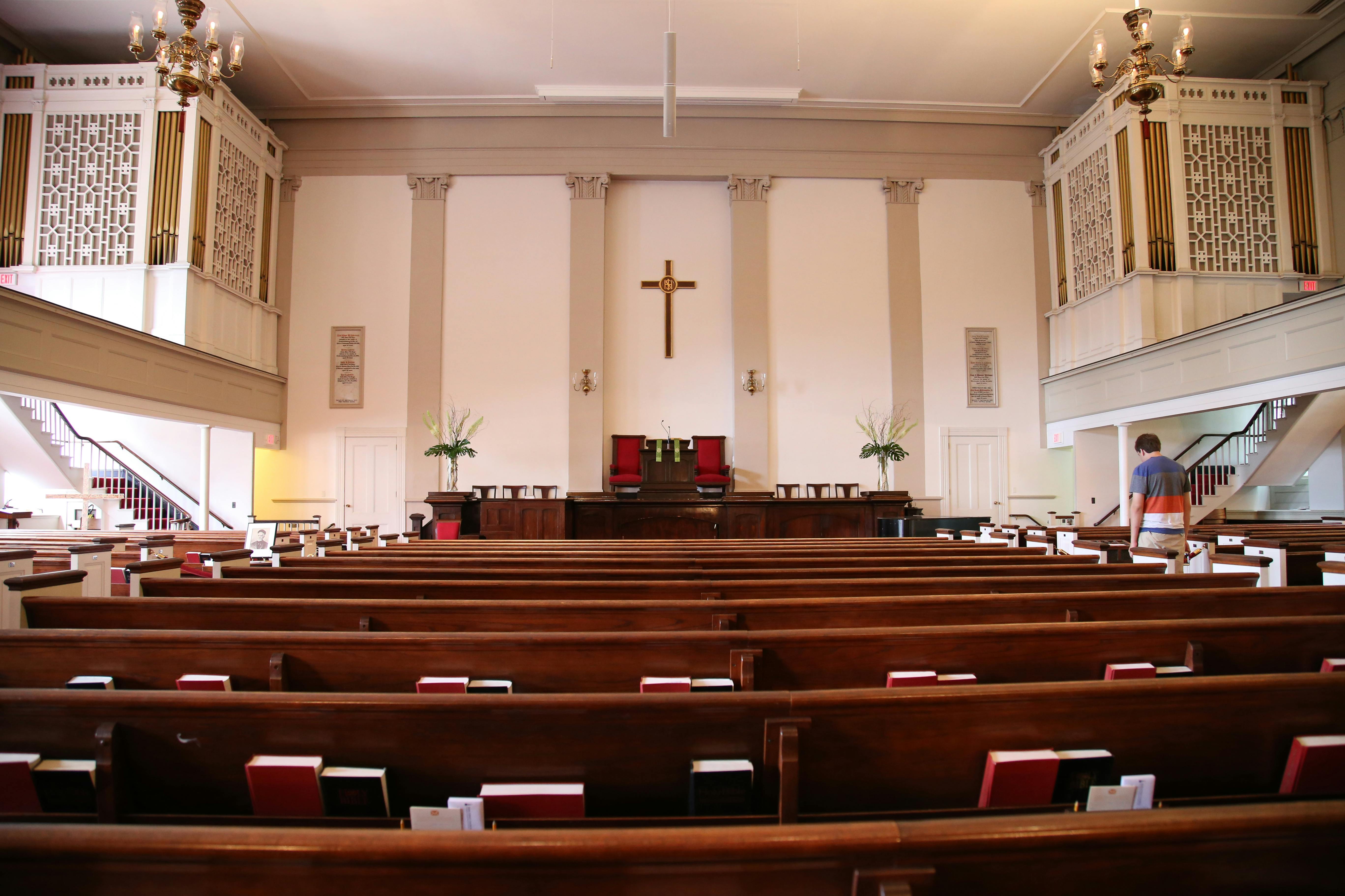 A Man Standing Inside the Church · Free Stock Photo