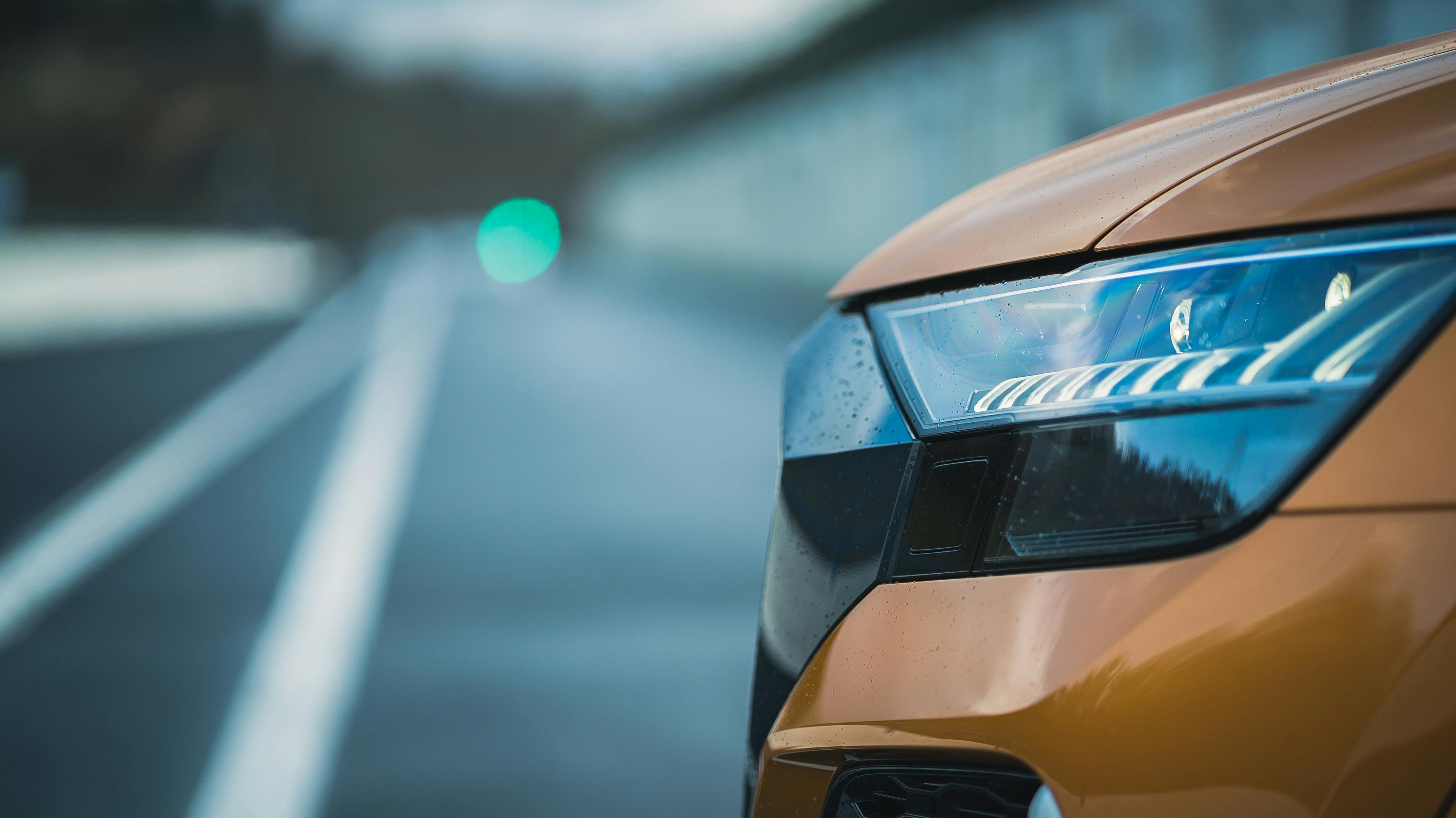 Wet Tail Light of a Black Car · Free Stock Photo