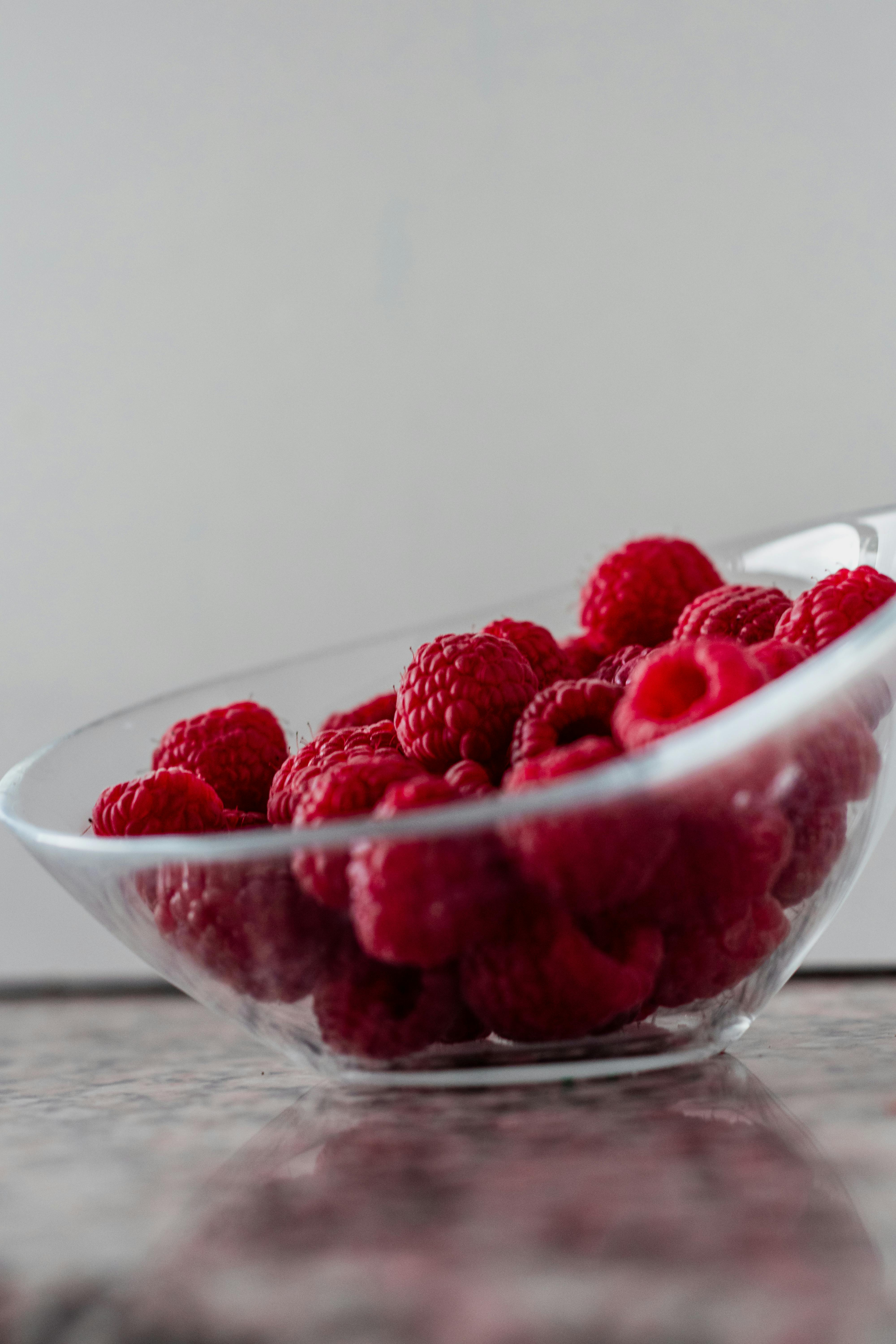 Raspberries in a Clear Glass Bowl · Free Stock Photo