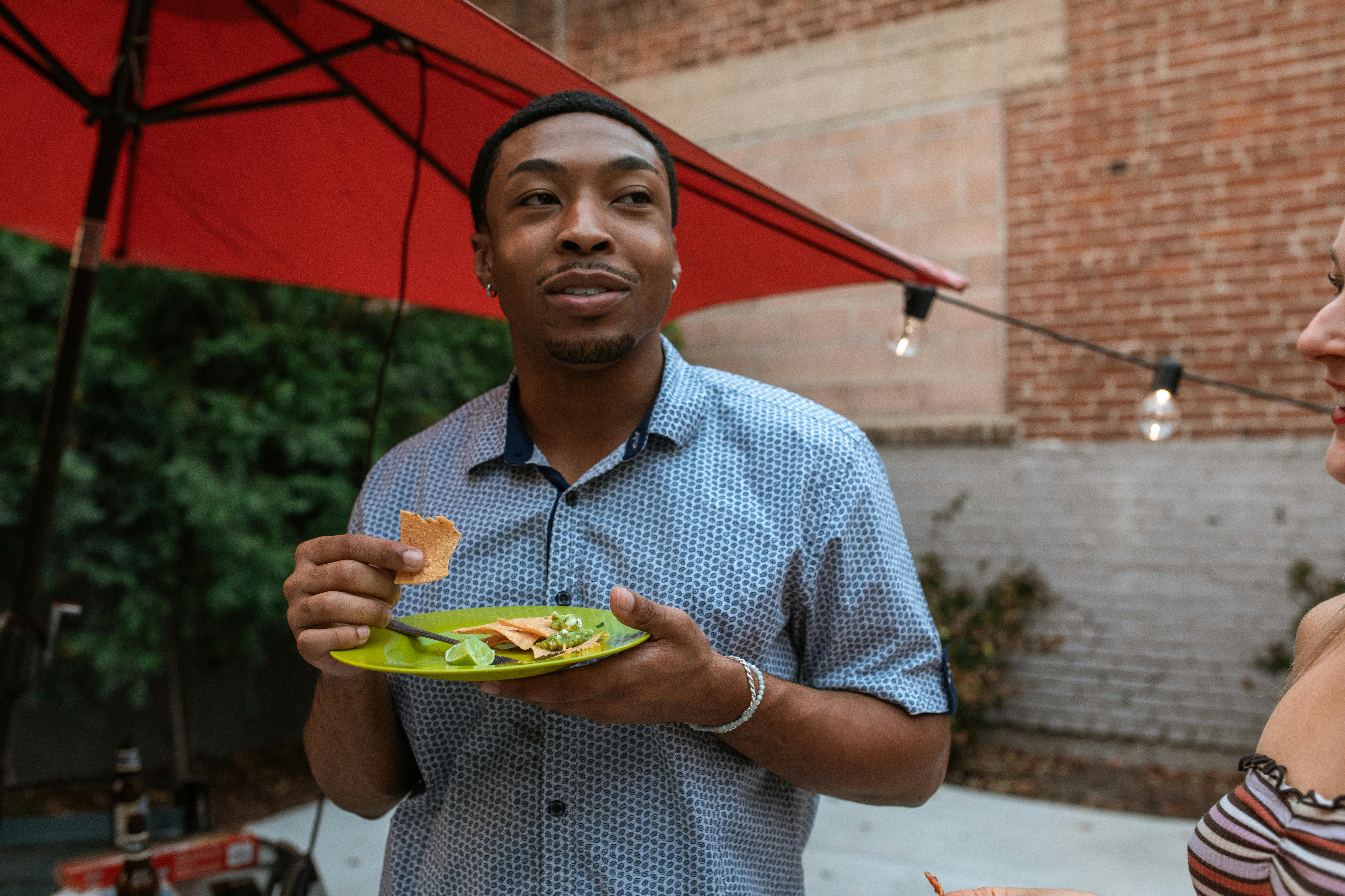 A Man Holding a Plate · Free Stock Photo