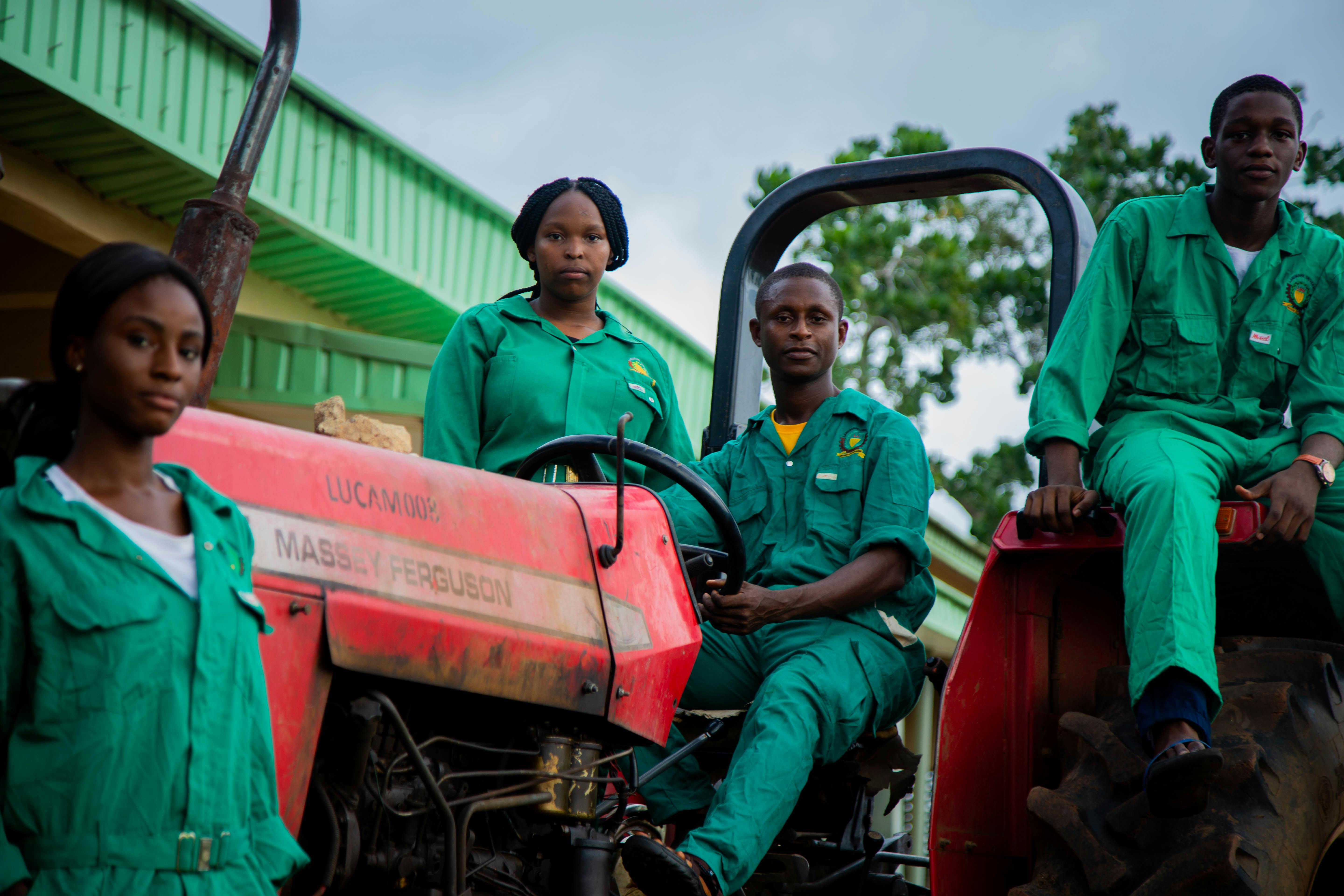 People Riding on Red Tractor · Free Stock Photo