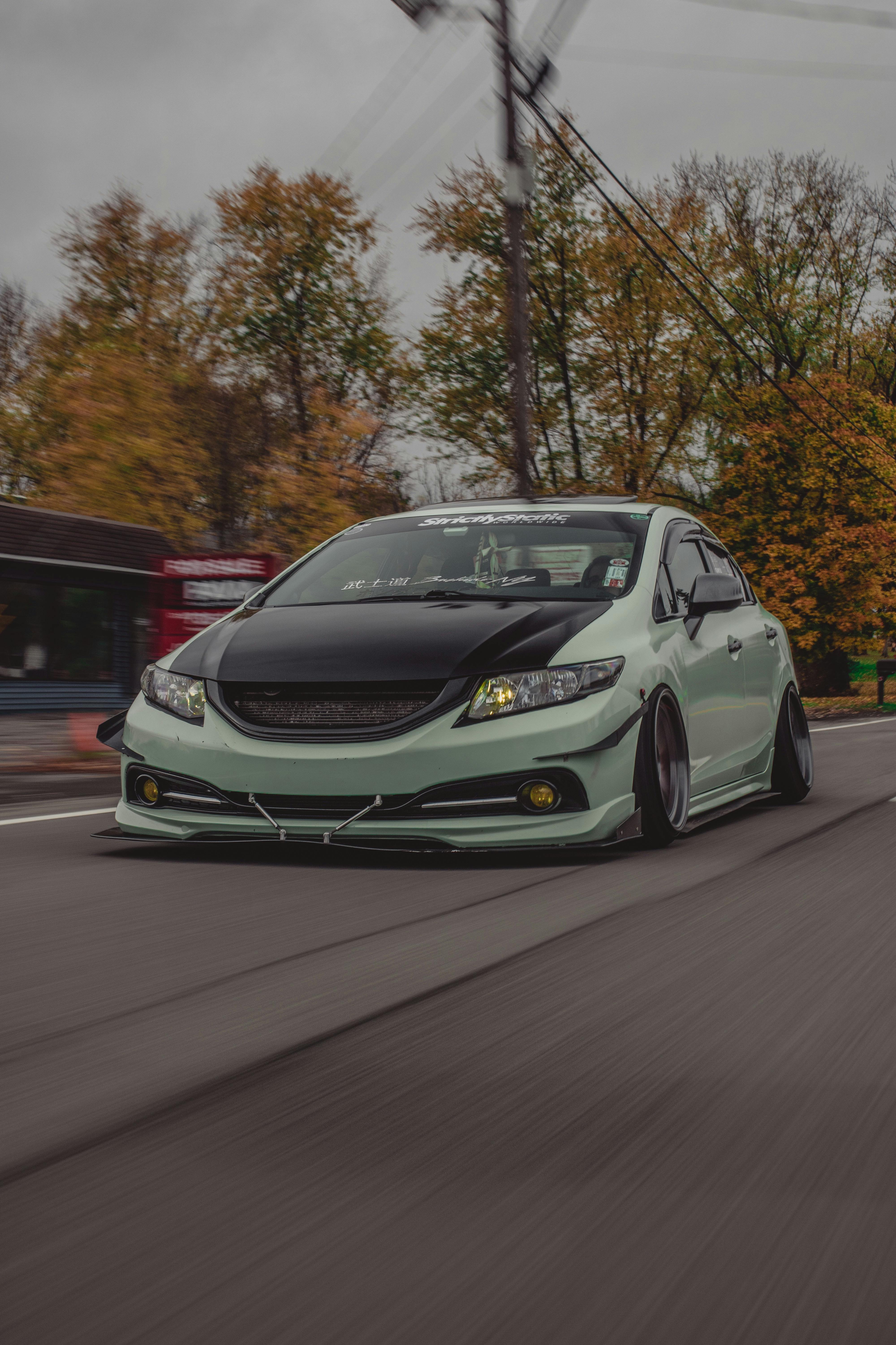 Car Driving Down the Road · Free Stock Photo