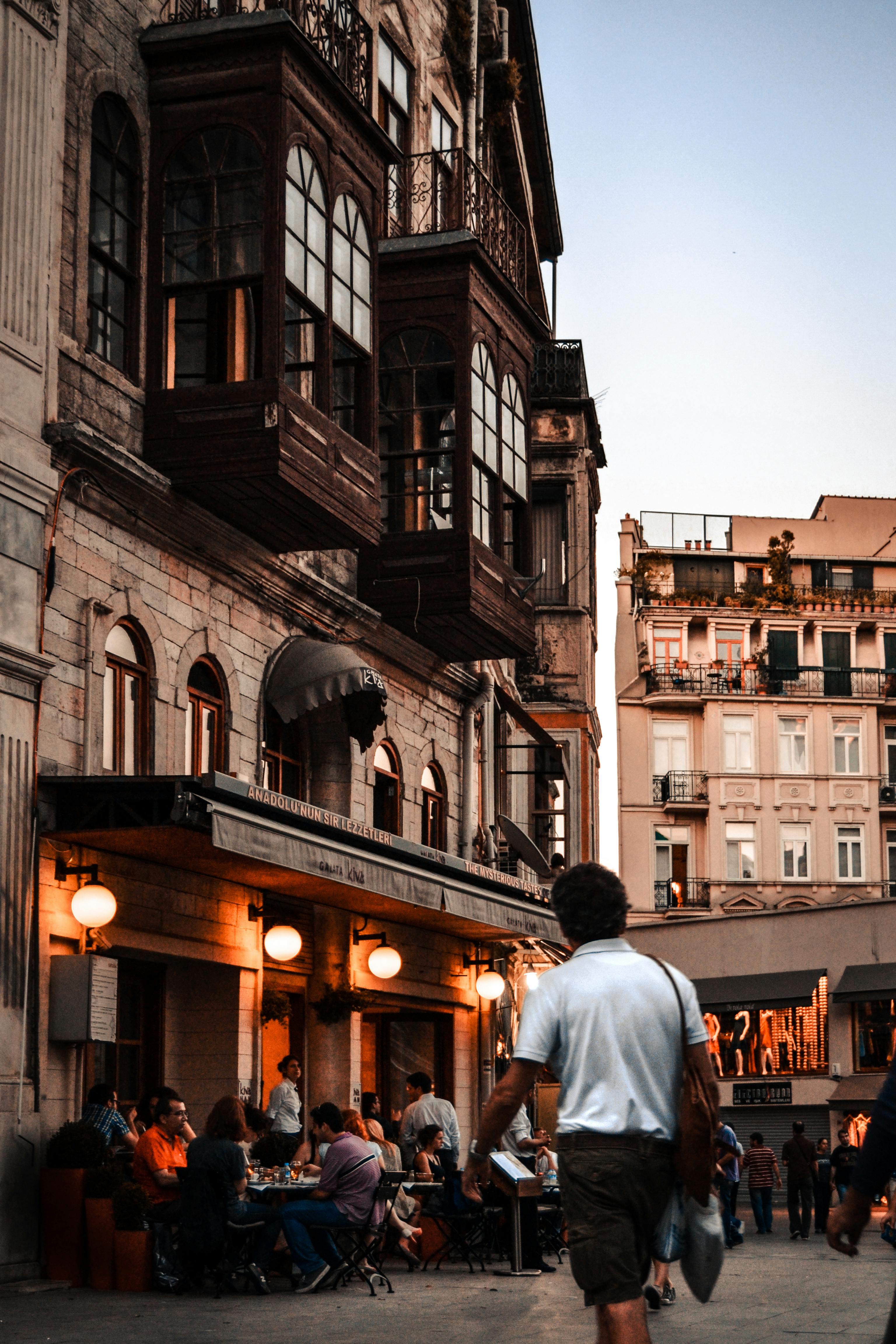 Busy narrow paved street with people · Free Stock Photo
