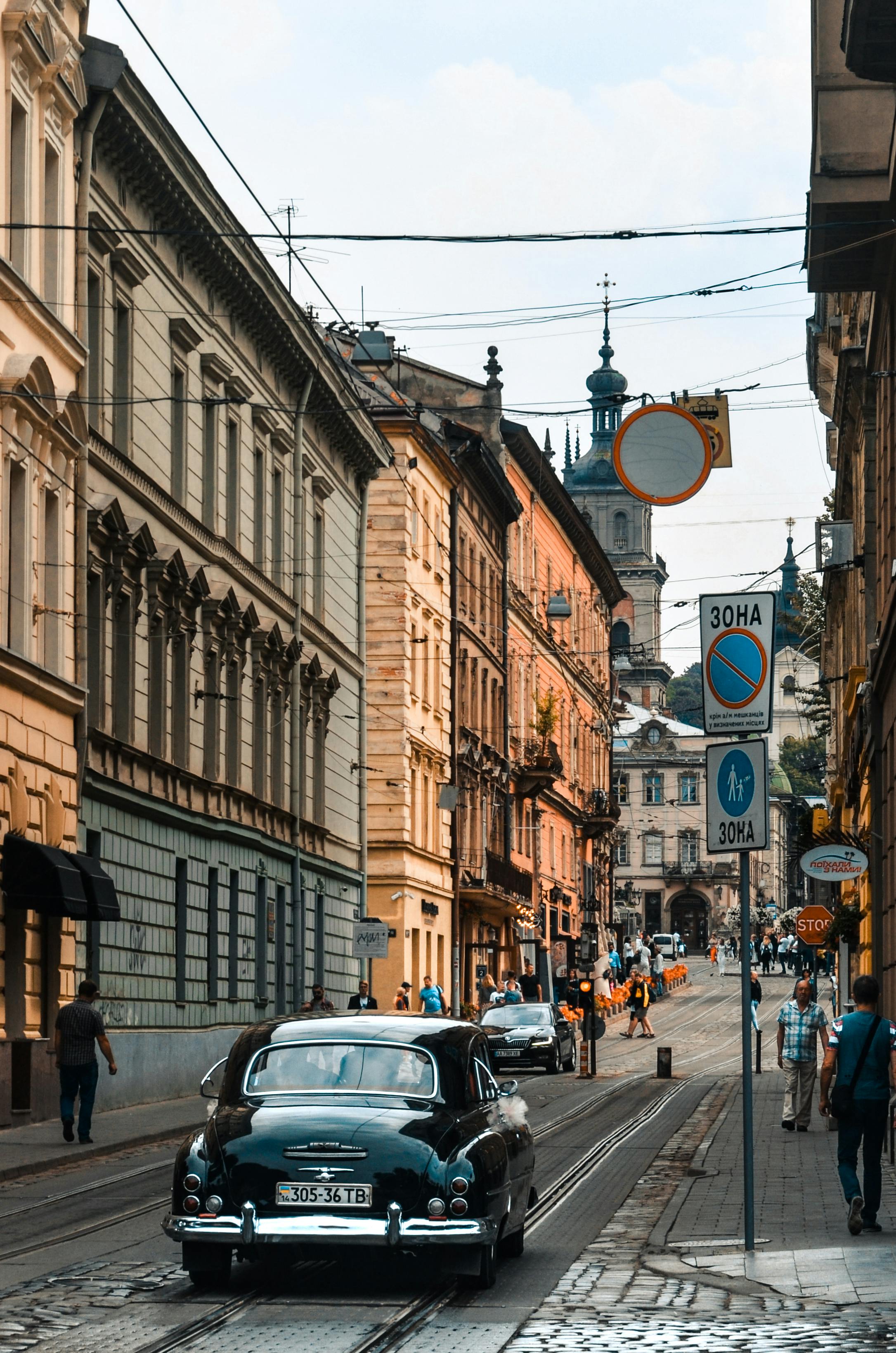 Colorful umbrellas decorating street of old city · Free Stock Photo