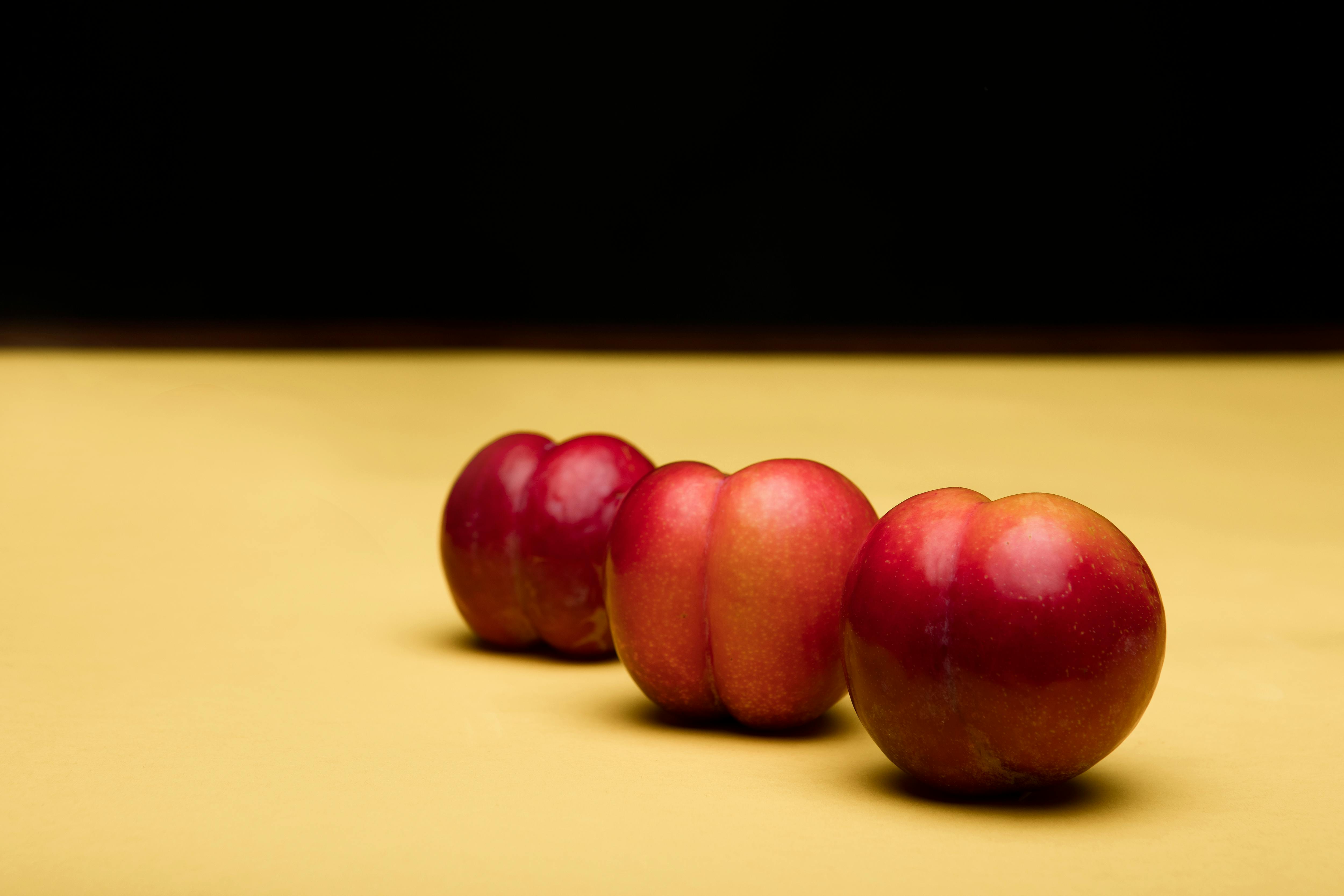 A Close-Up Shot of a Peach on a Book · Free Stock Photo