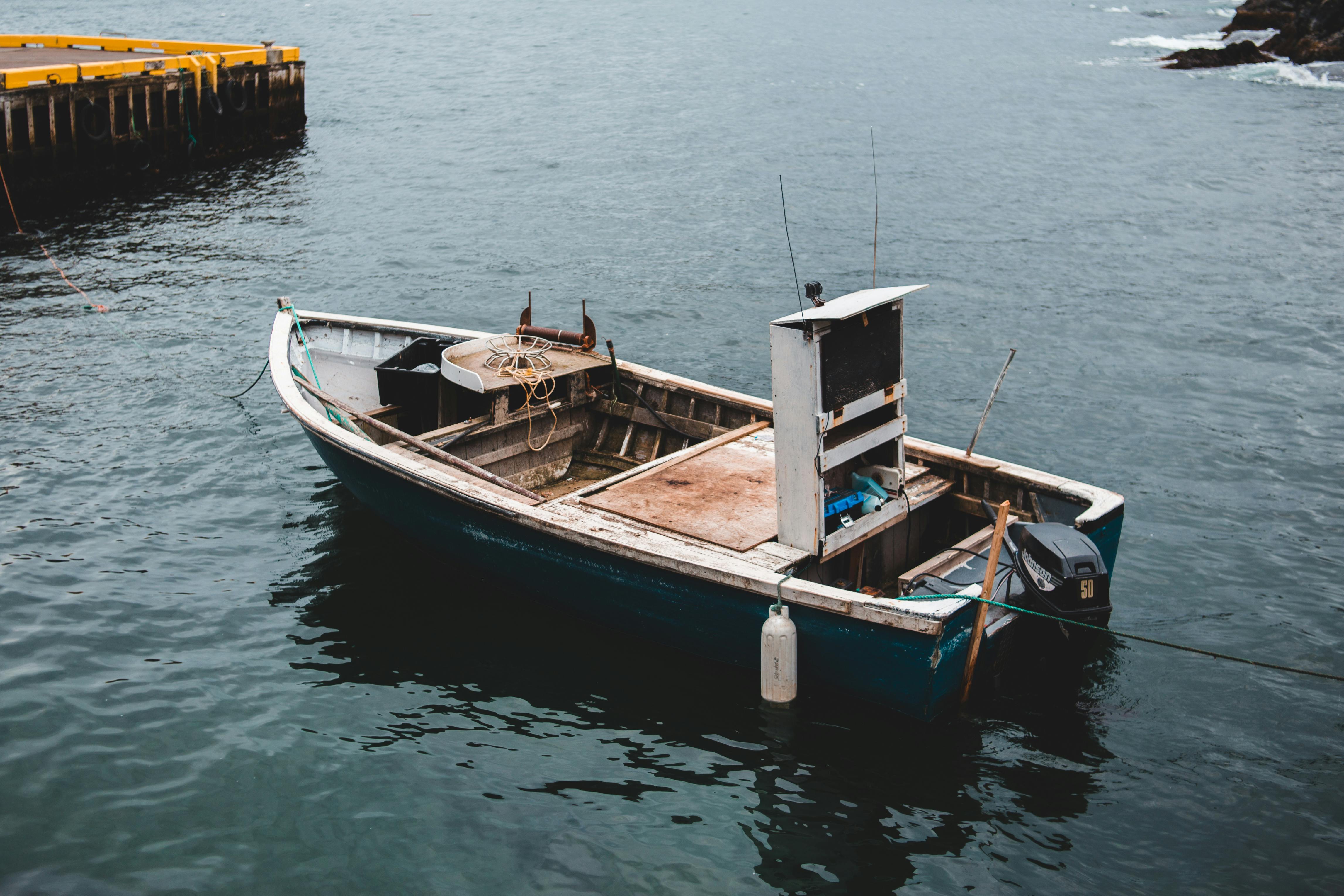 Colorful wooden fishing boats on sandy seashore · Free Stock Photo