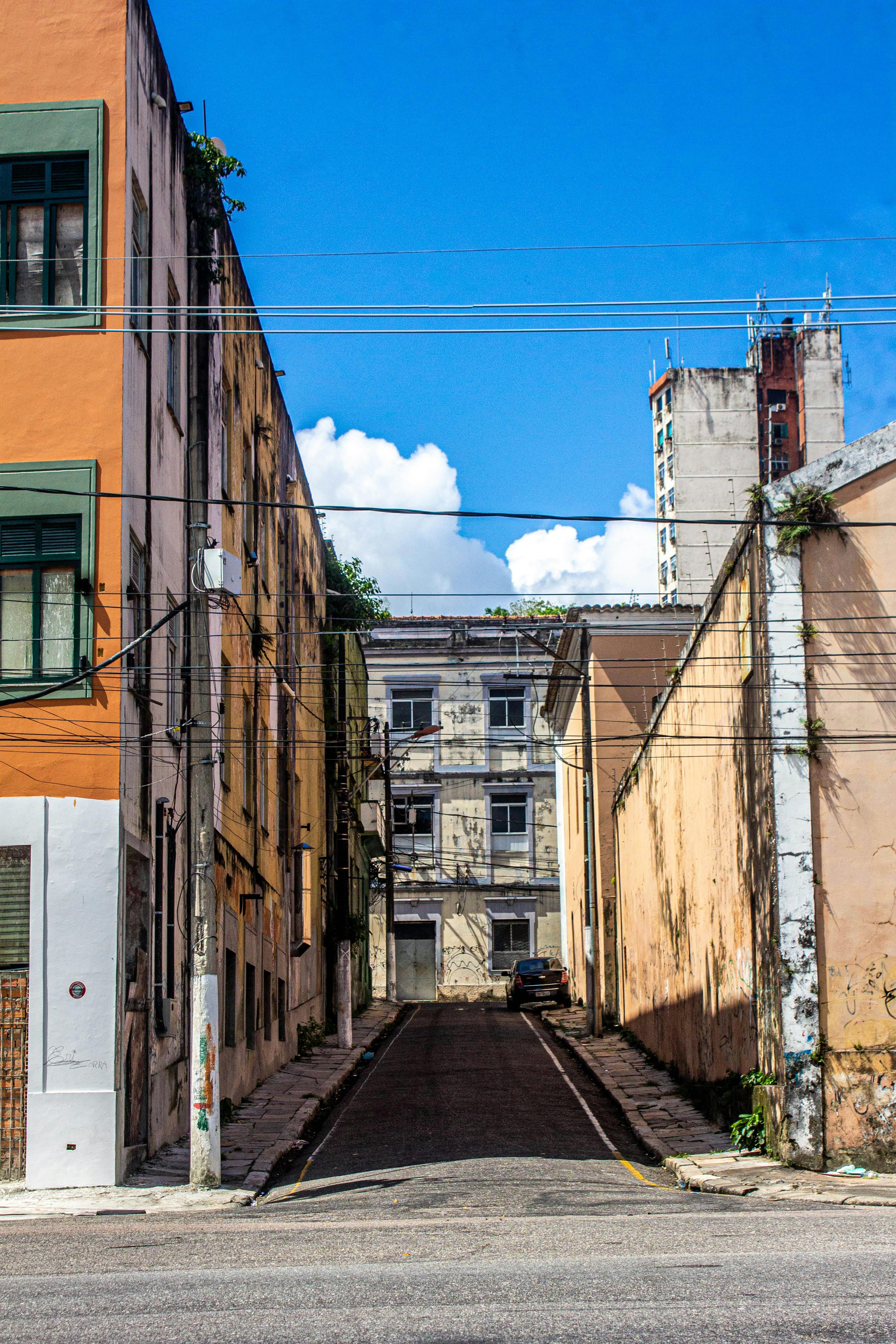 A Street in Between the Concrete Buildings · Free Stock Photo