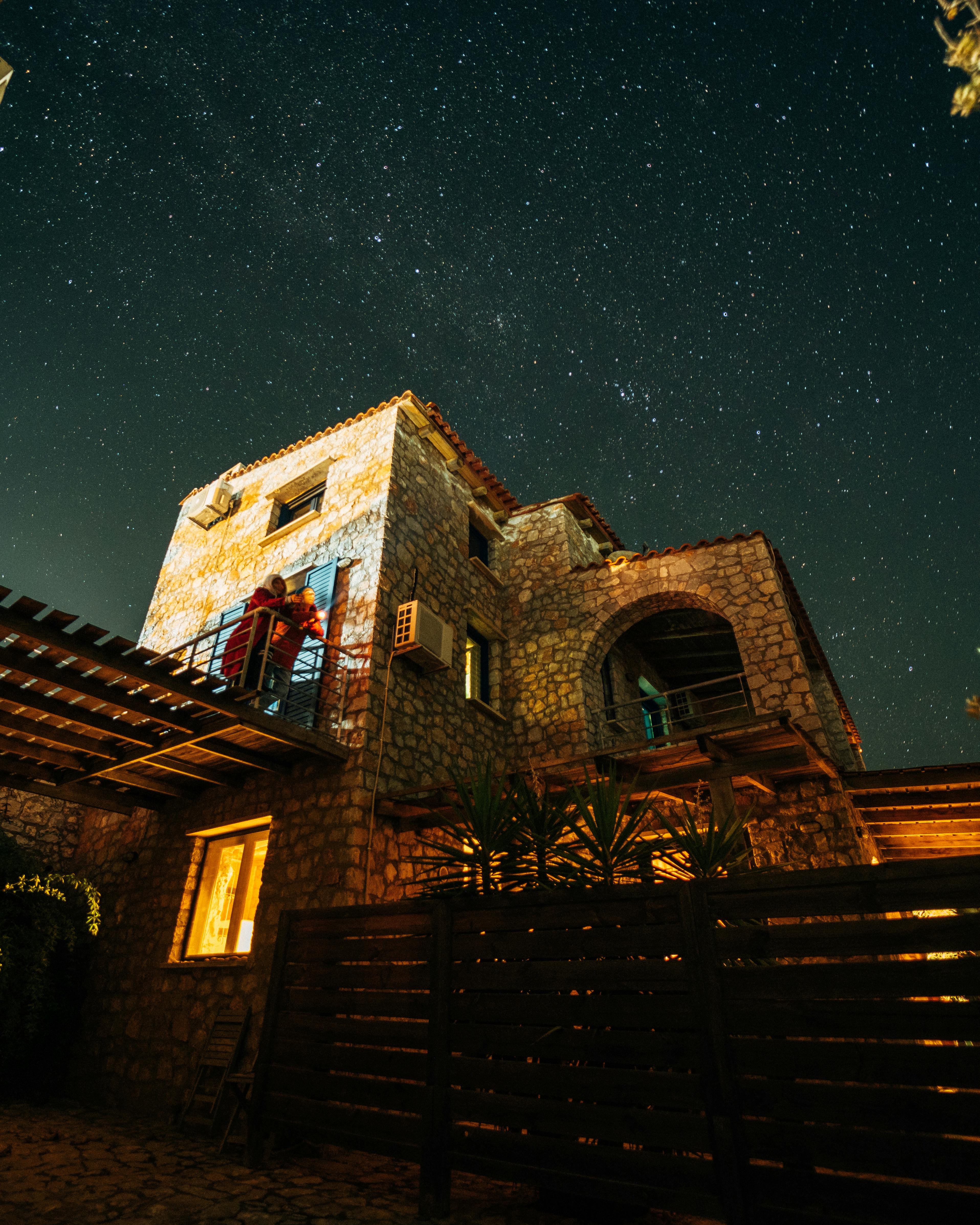 A Brick House Under a Starry Night Sky · Free Stock Photo