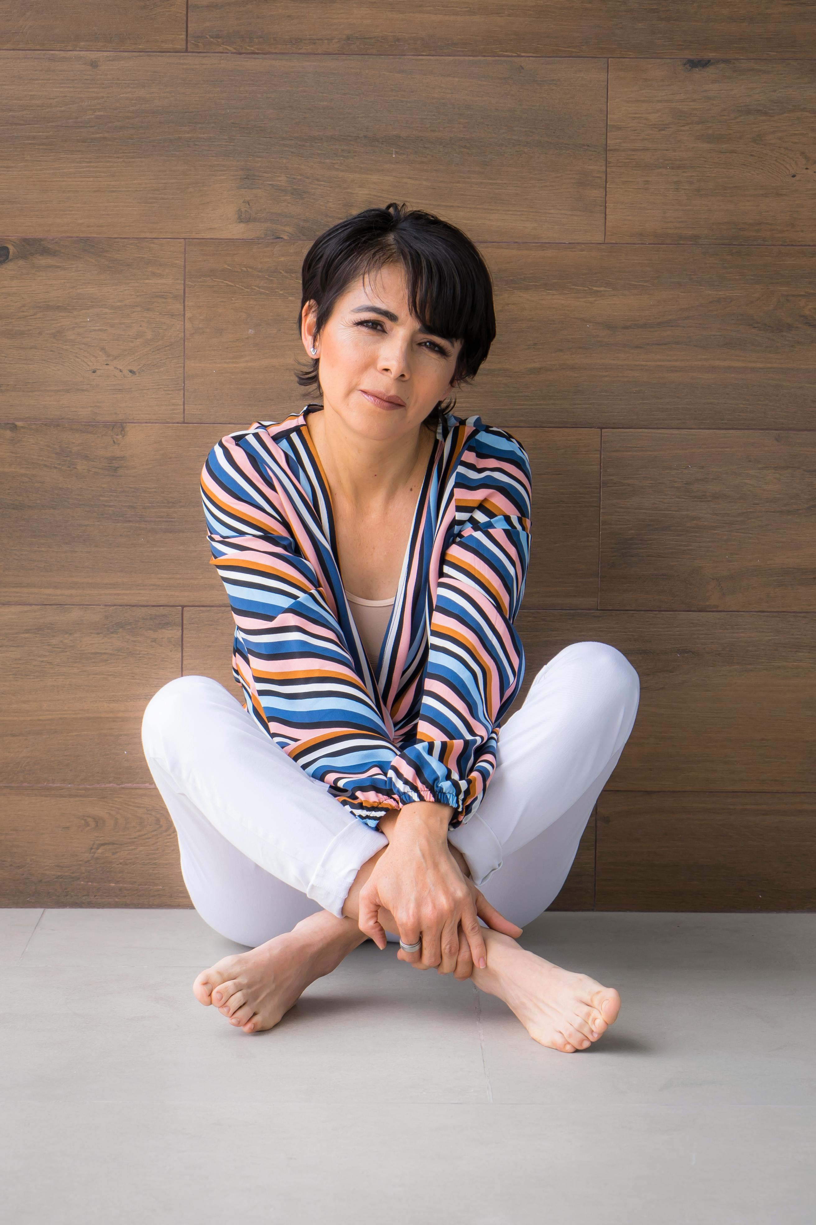 Woman in Striped Long Sleeves and White Pants Sitting on the Floor ...