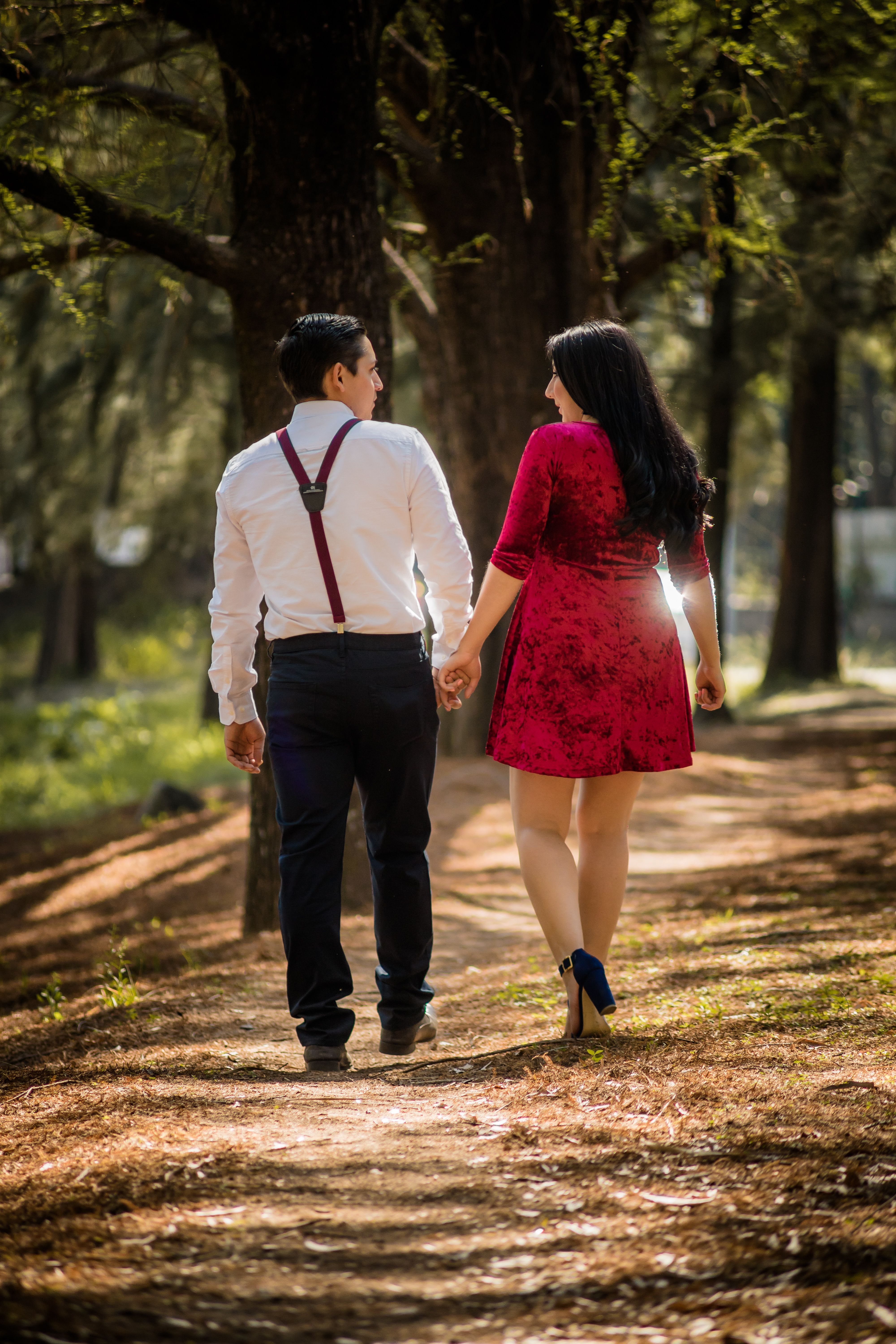 Back View Of Couple Holding Hands · Free Stock Photo