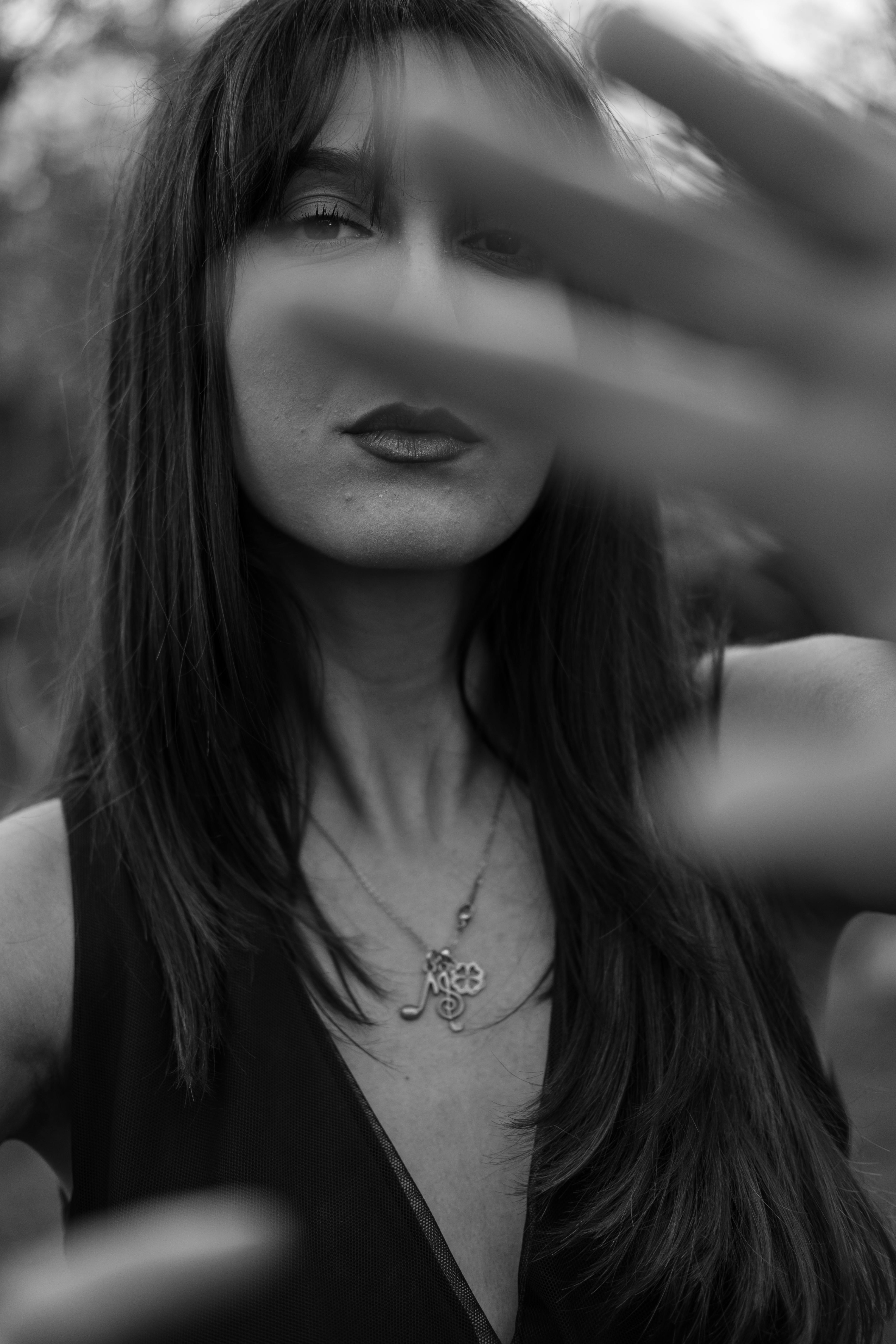 Raised female hand against wall · Free Stock Photo