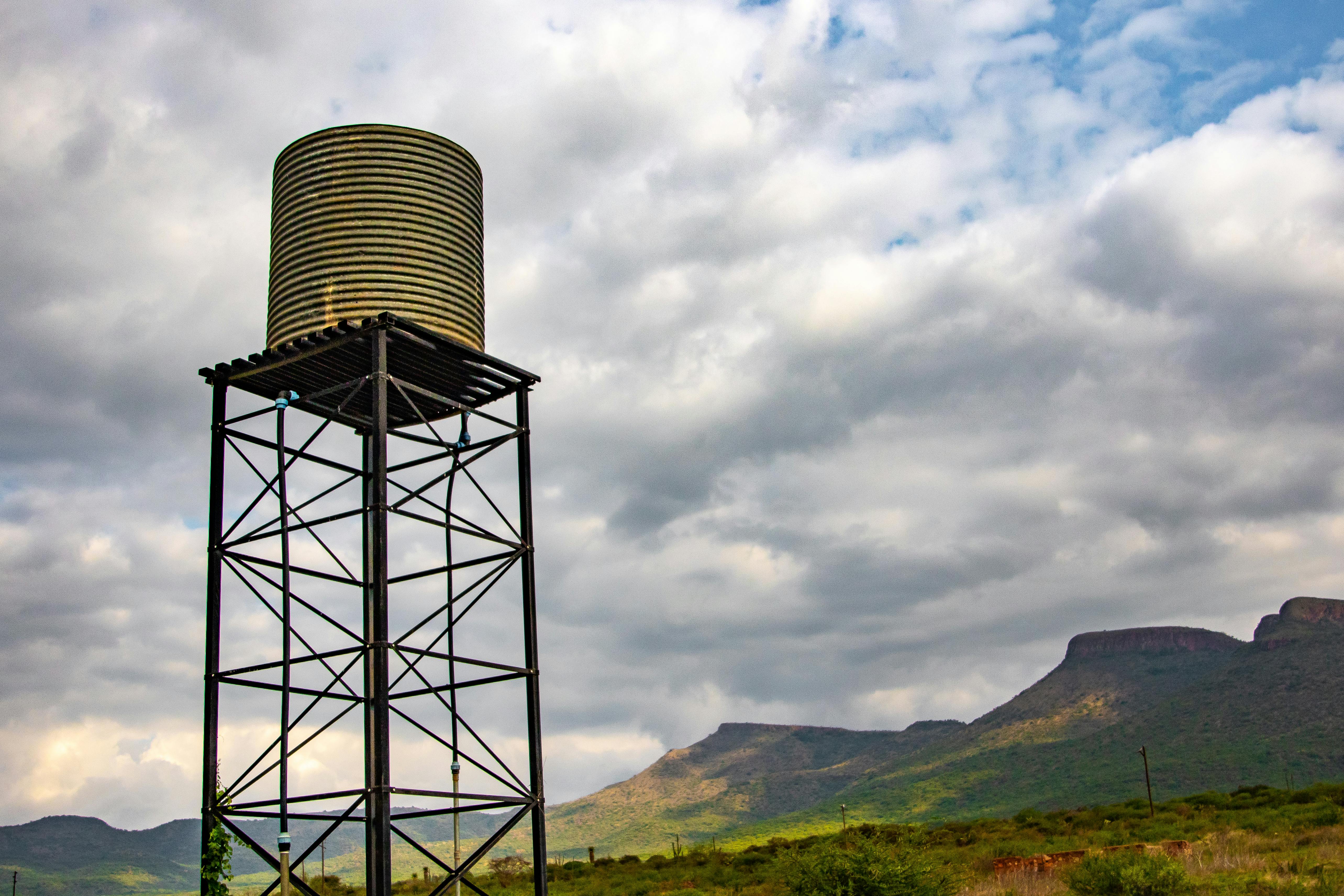 A Water Tank under a Cloudy Sky · Free Stock Photo