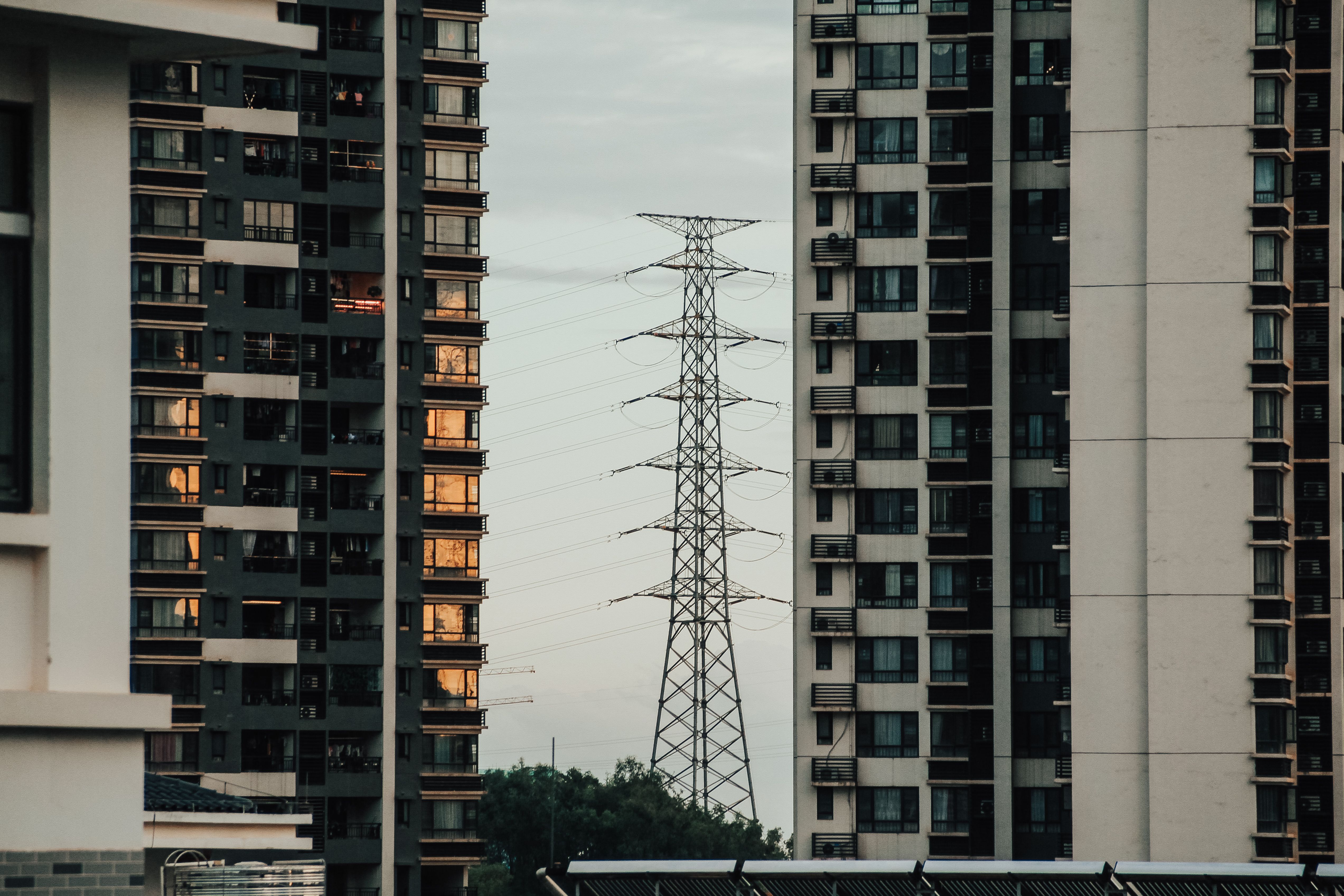 Wire tower between modern multistage residential buildings · Free Stock ...