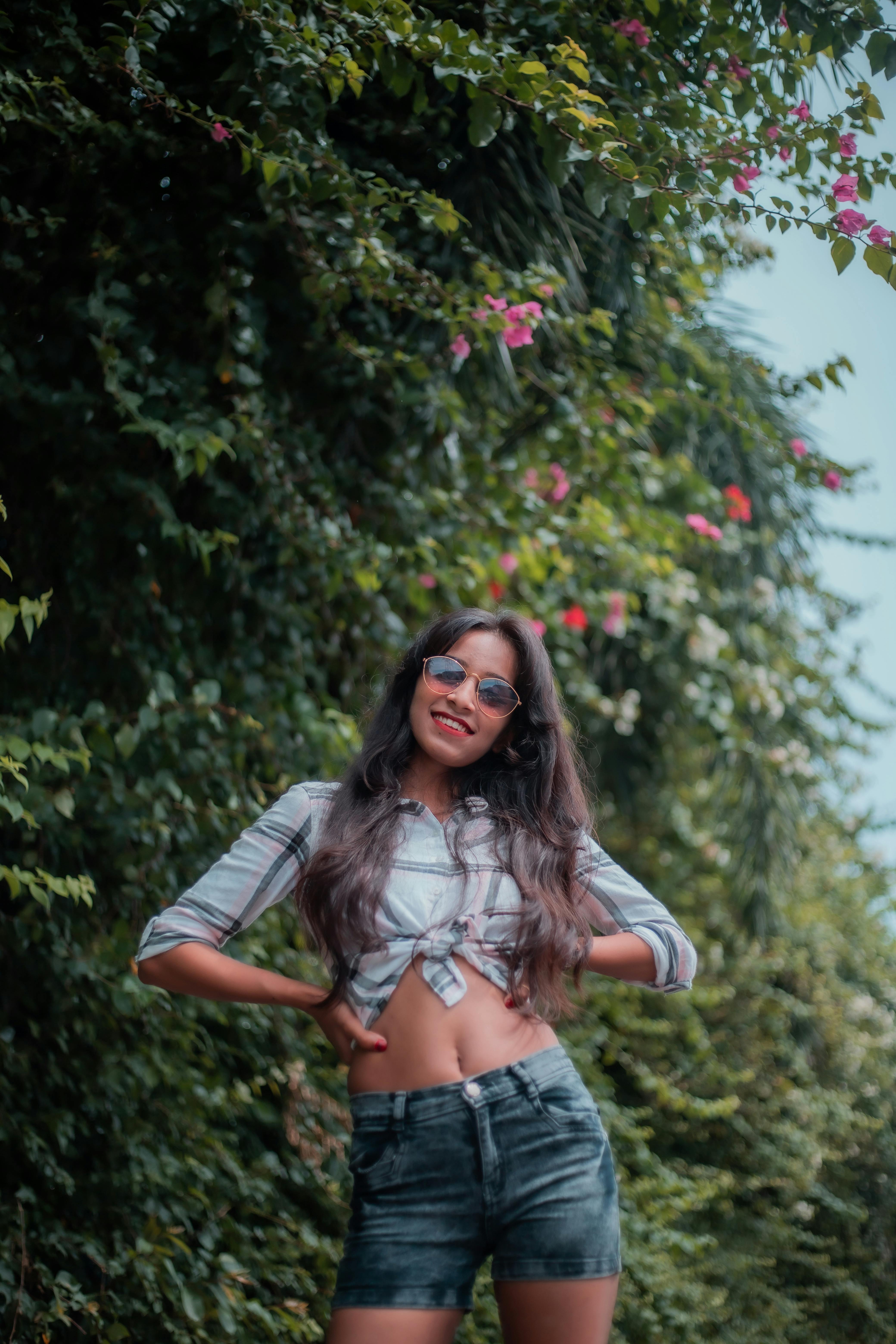 Woman Wearing a Mini Dress Standing Beside Tree · Free Stock Photo