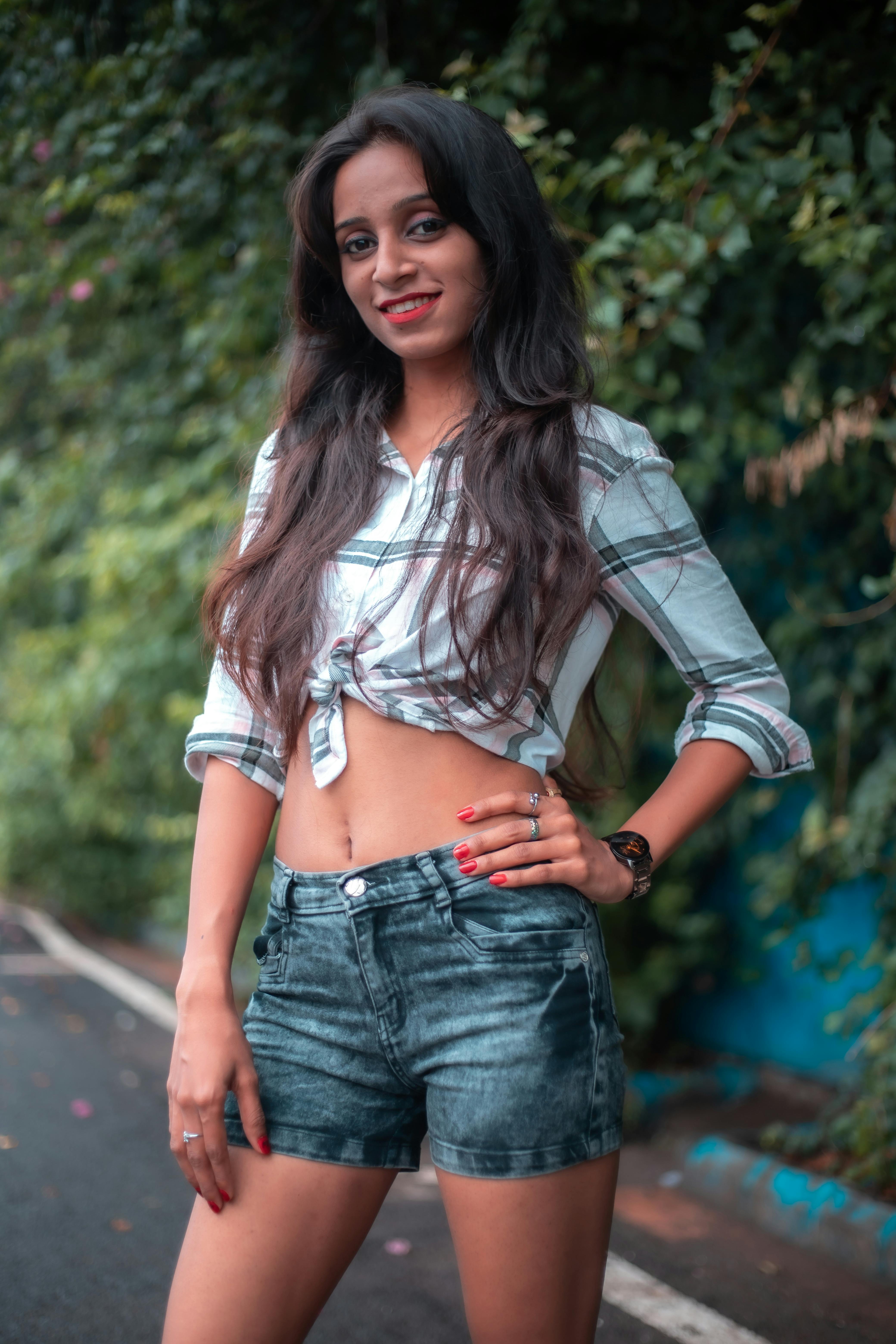 Brunette Woman in a Summer Outfit Posing Outdoors · Free Stock Photo