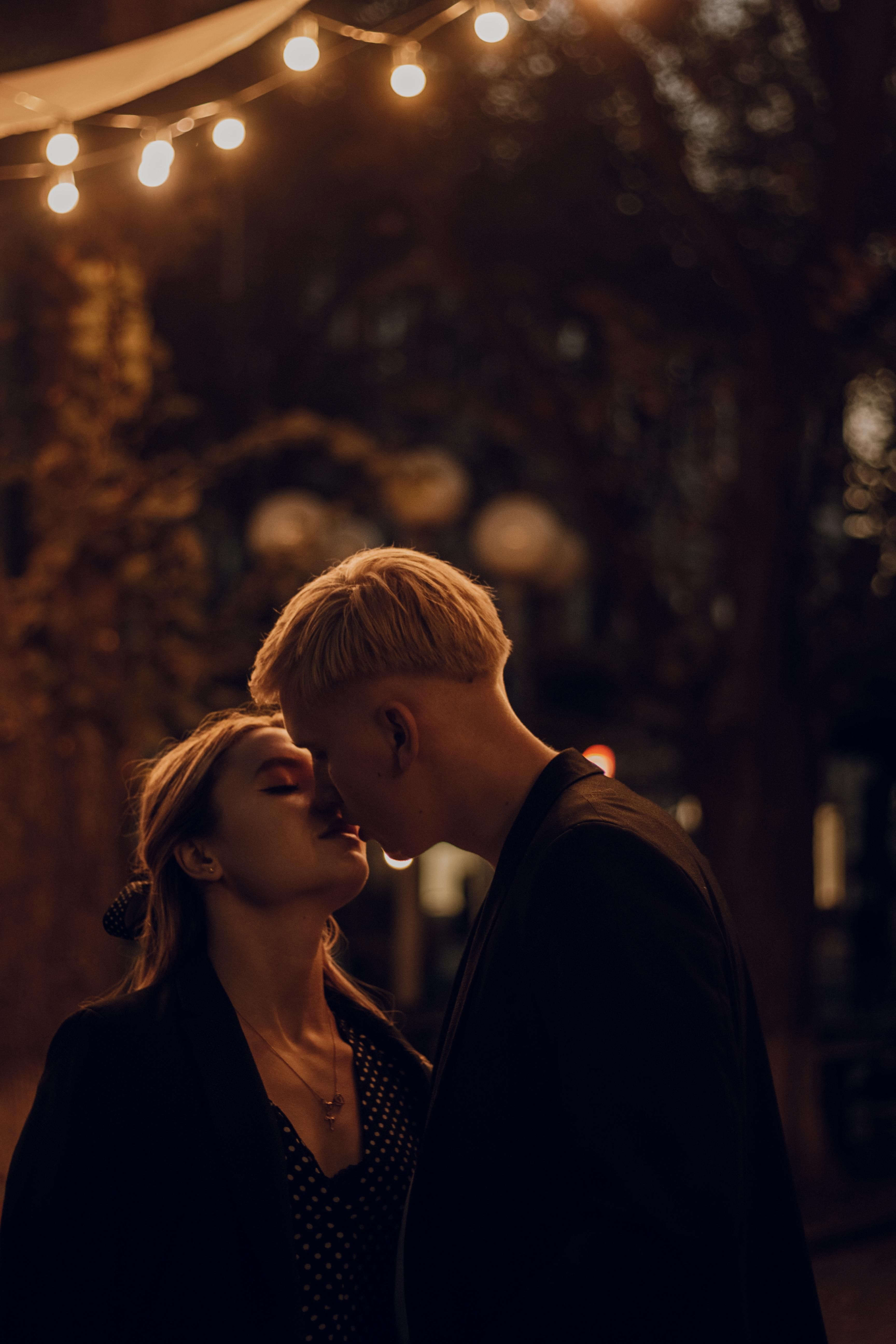Romantic couple hugging in park at night · Free Stock Photo