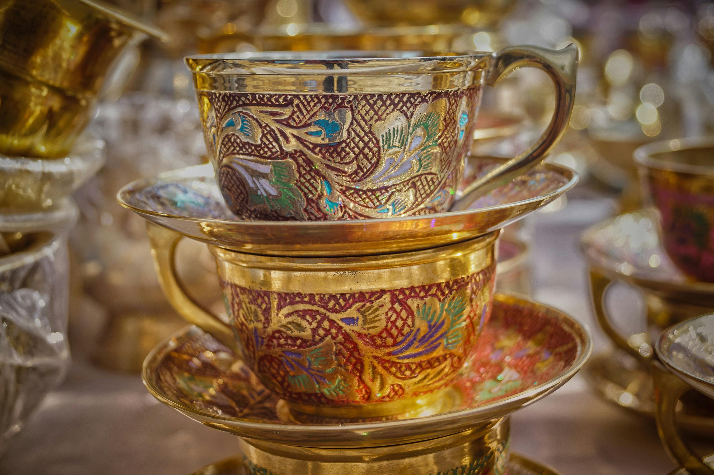 Golden Cups in Close Up Shot · Free Stock Photo