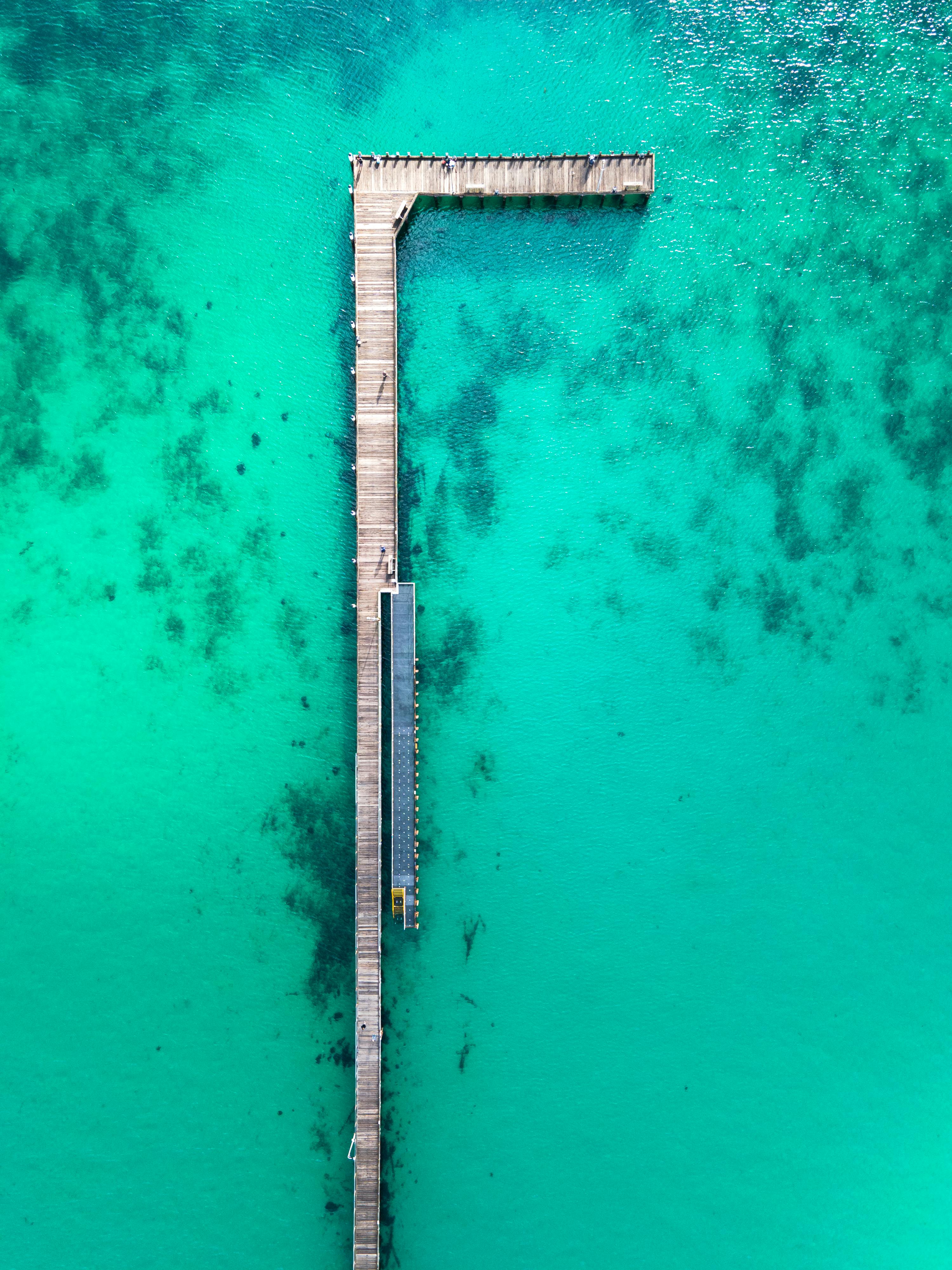 Aerial View of Concrete Jetty in Turquoise Water · Free Stock Photo